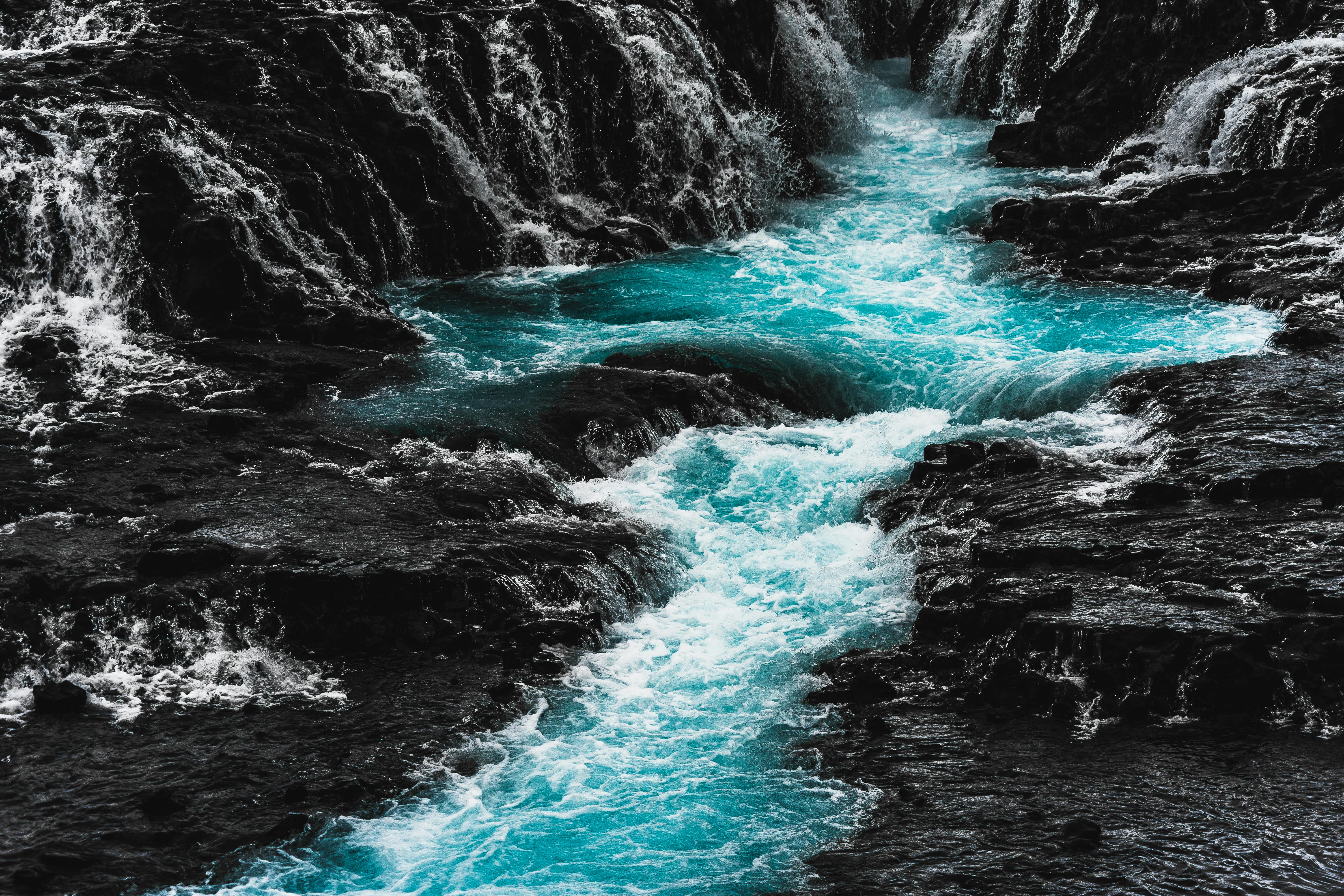 Blue River Among Colorless Cascades · Free Stock Photo