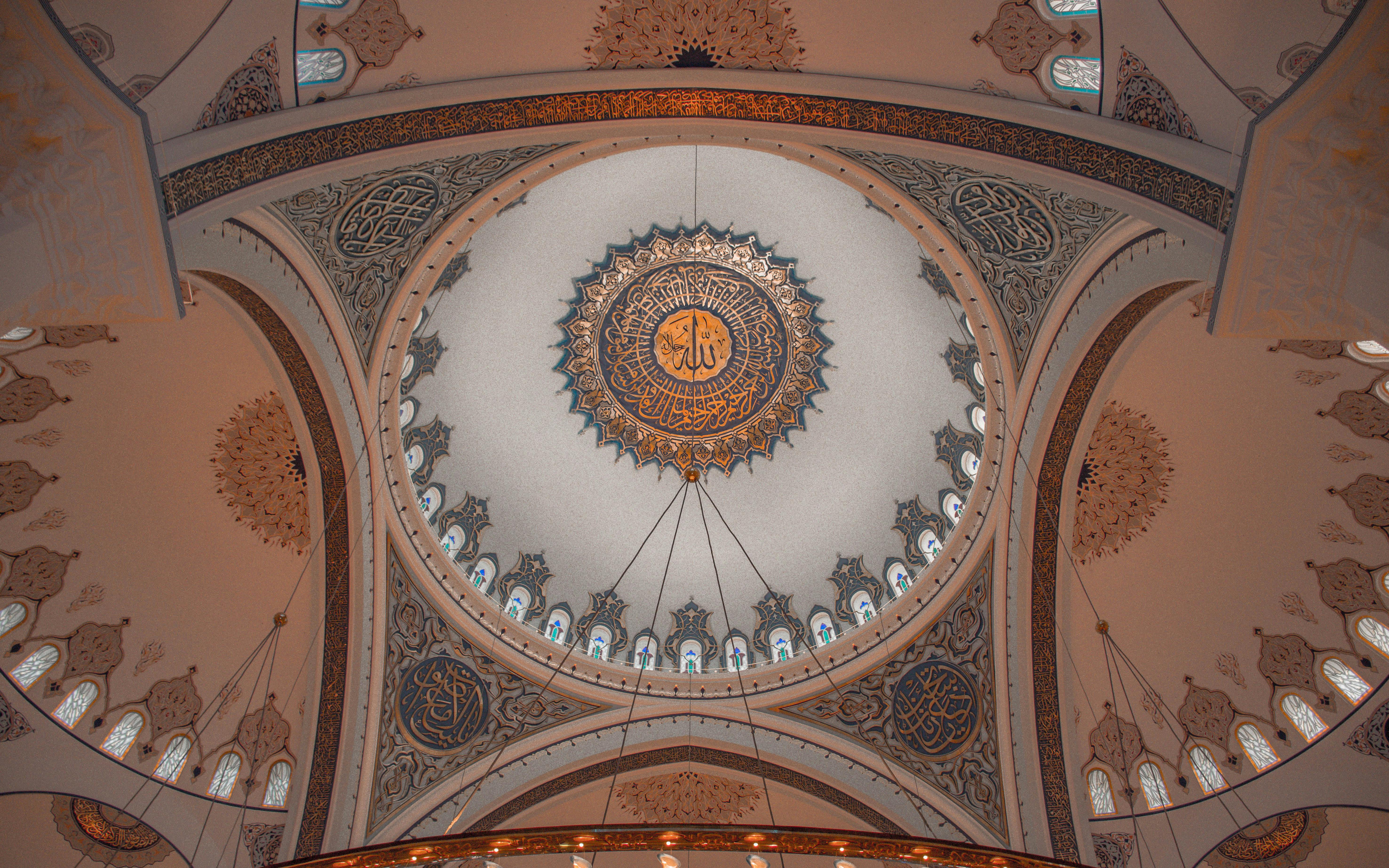 Old stone tower with spiky spire under blue cloudy sky · Free Stock Photo
