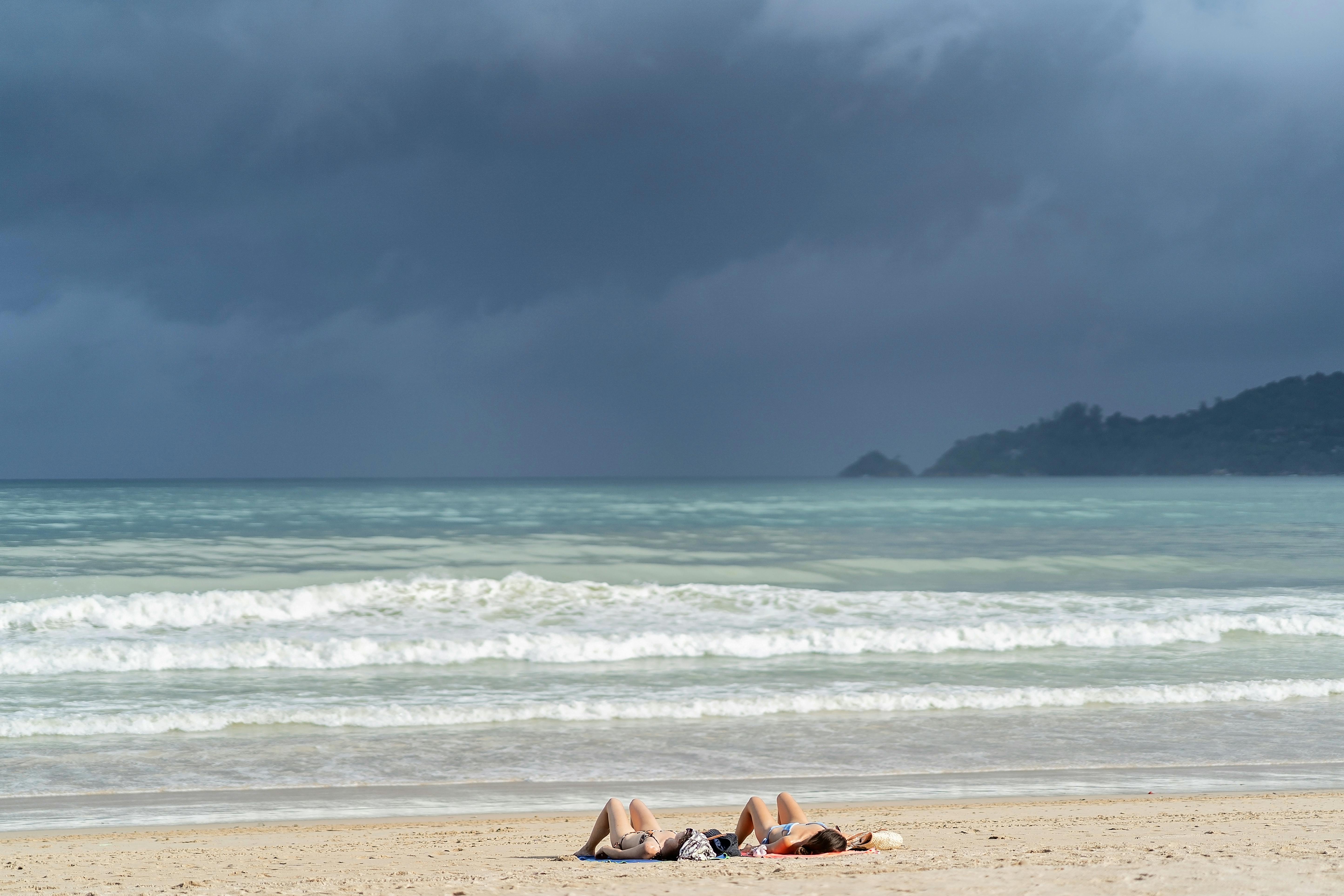 Two Persons Doing Sunbathing · Free Stock Photo