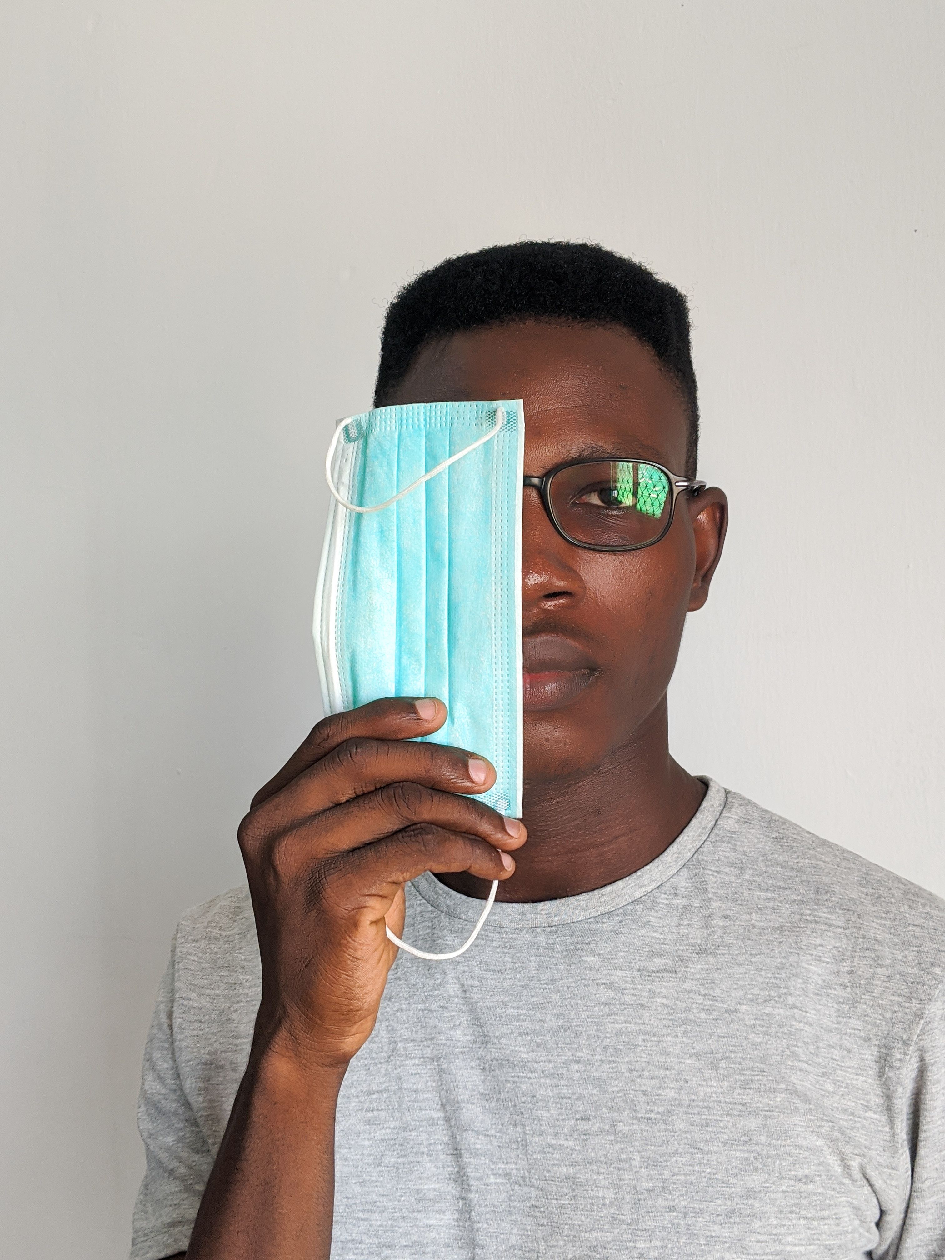 Man Covering Face With Mask · Free Stock Photo