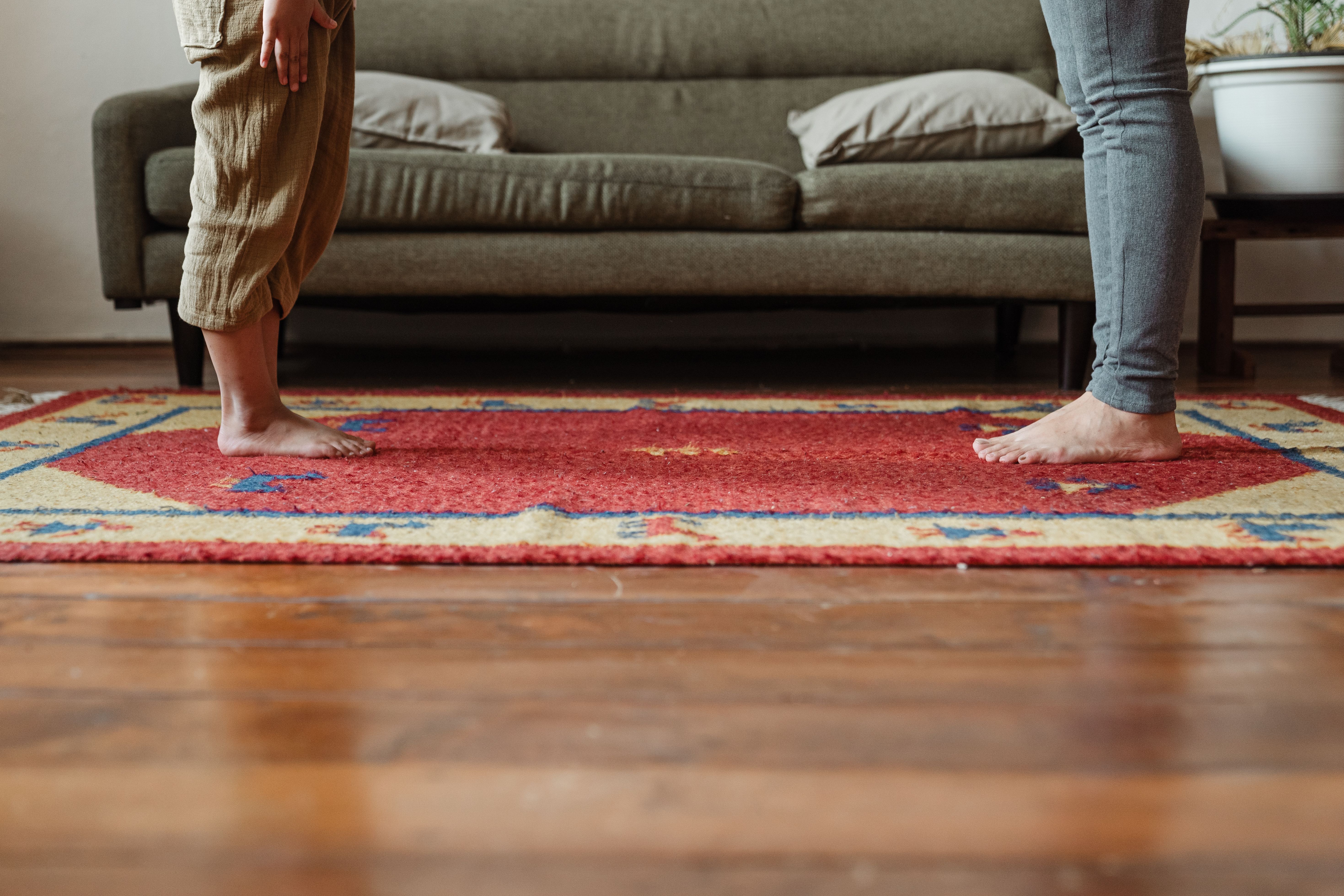 Photo of Two Persons Standing on Carpet · Free Stock Photo