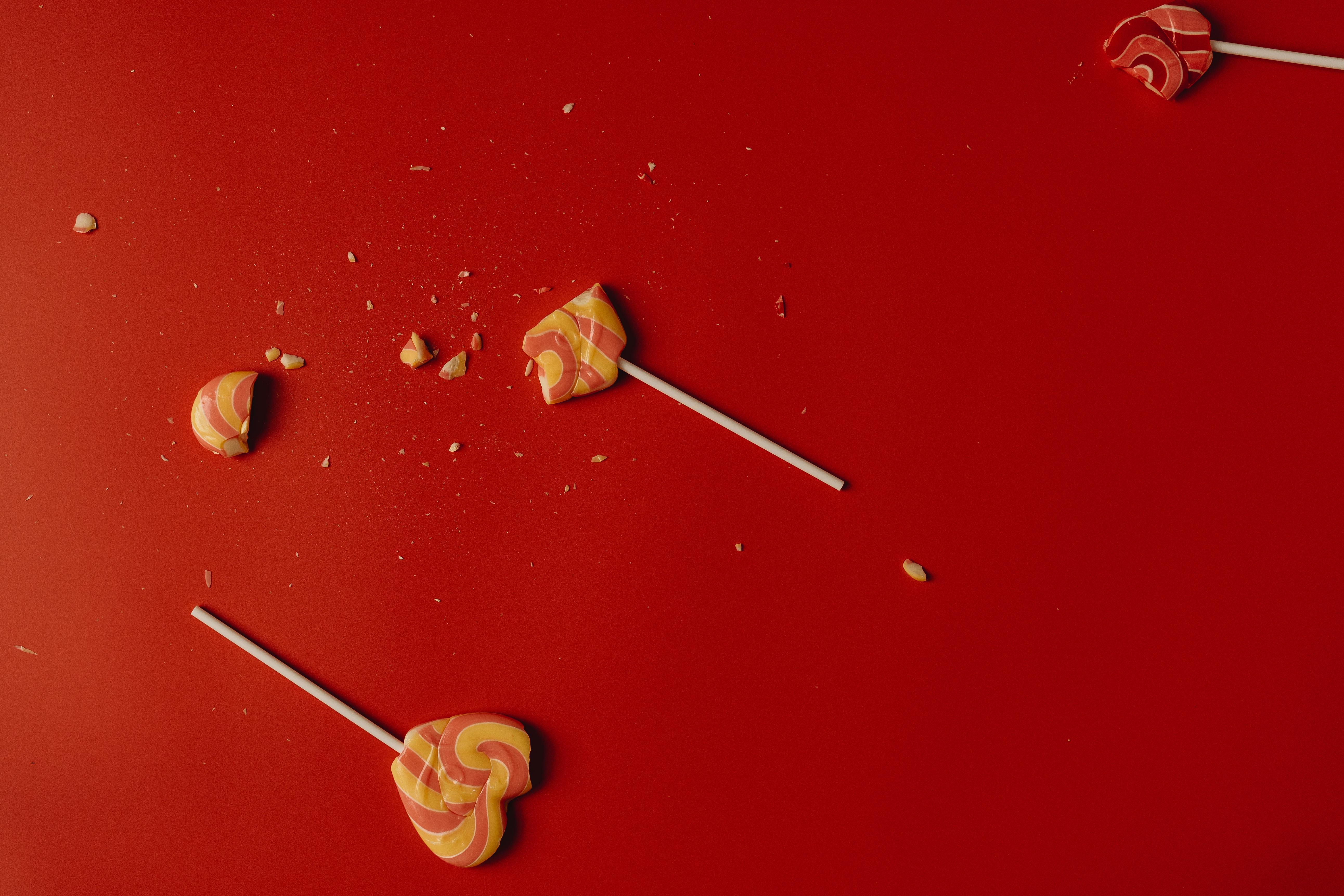 Close-Up Photo of a Red Broken Heart Shaped Lollipop · Free Stock Photo