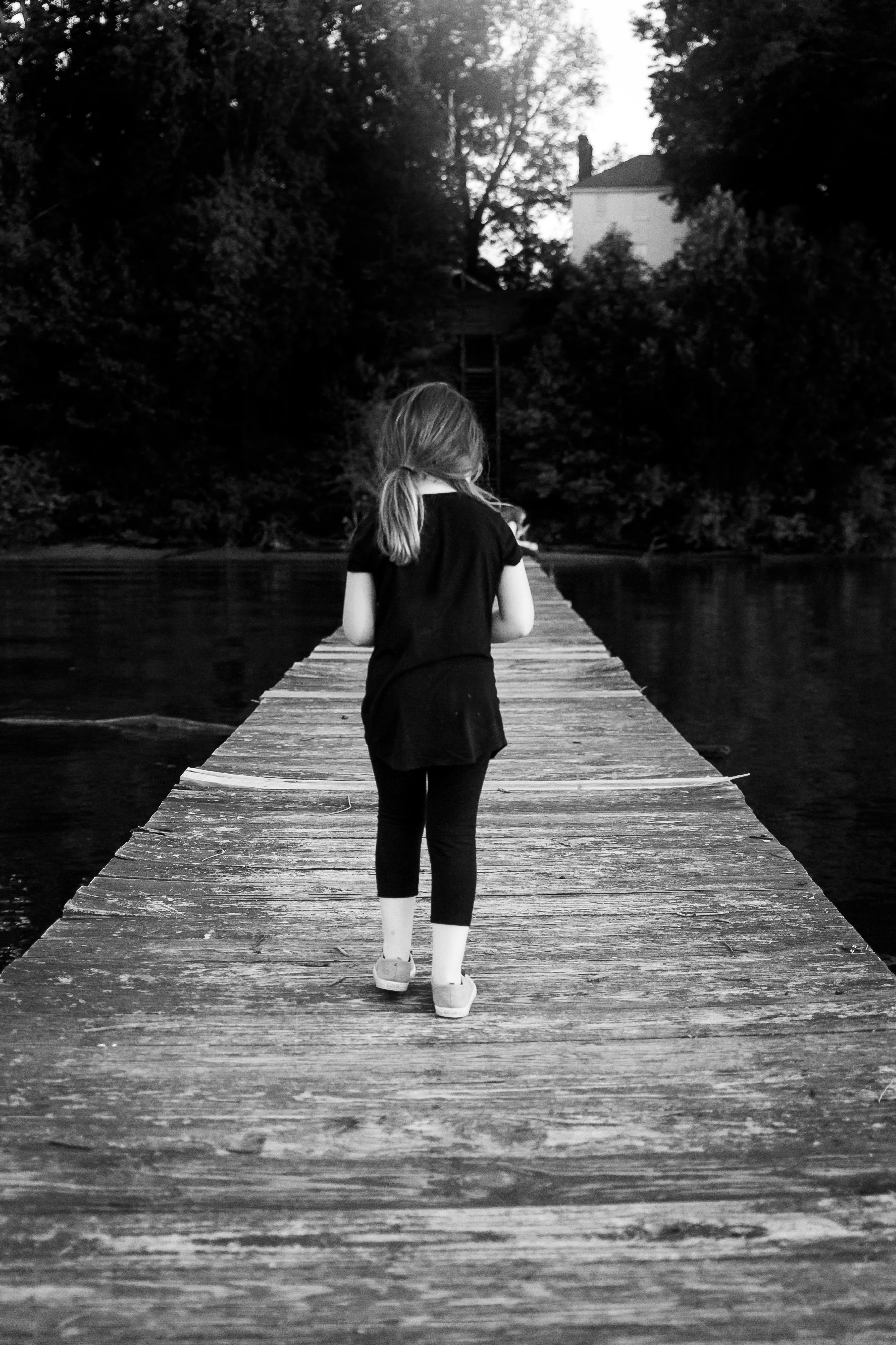 Girl Walking in Wooden Dock · Free Stock Photo