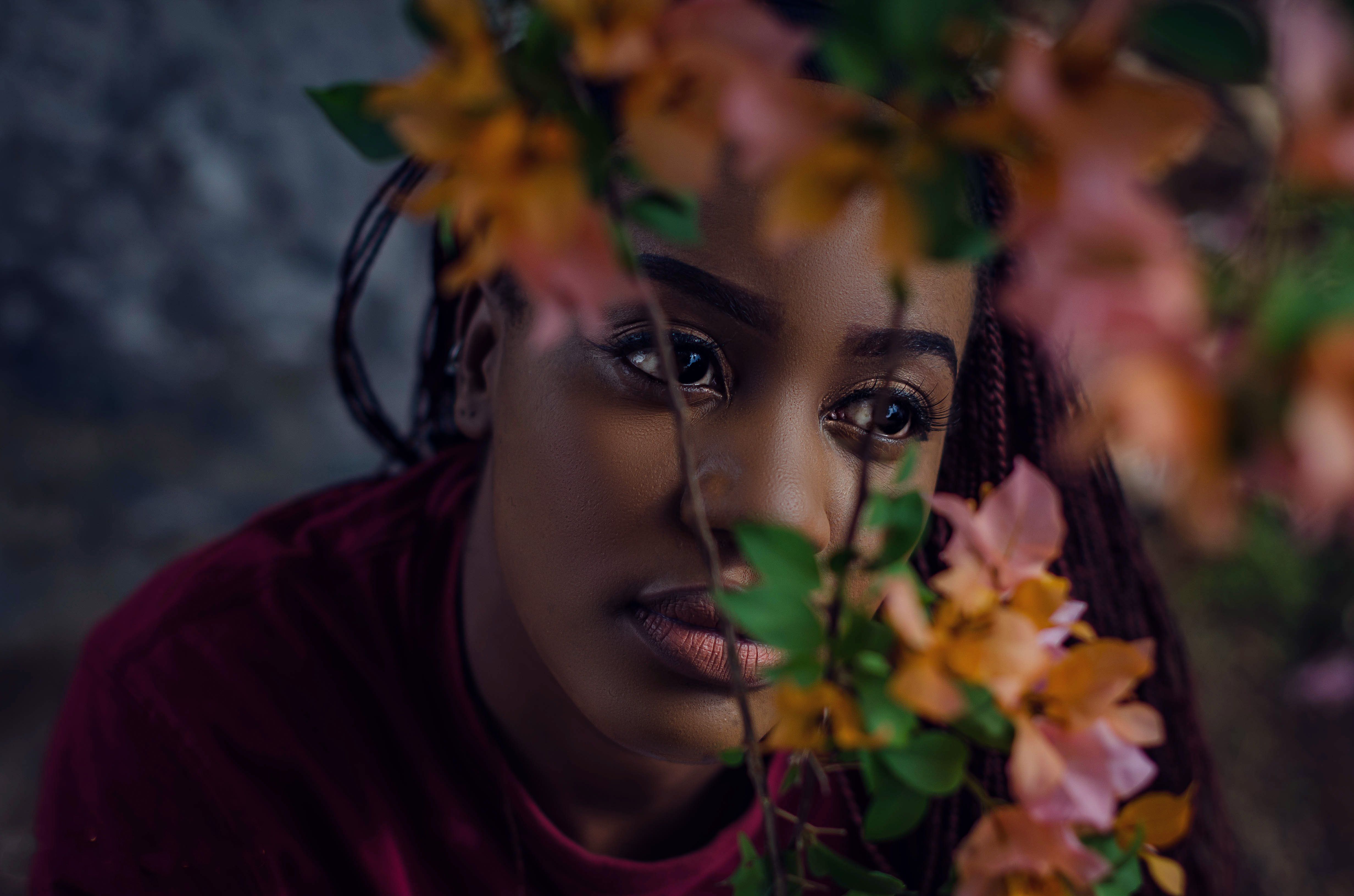 Woman's Face Behind a Plant · Free Stock Photo