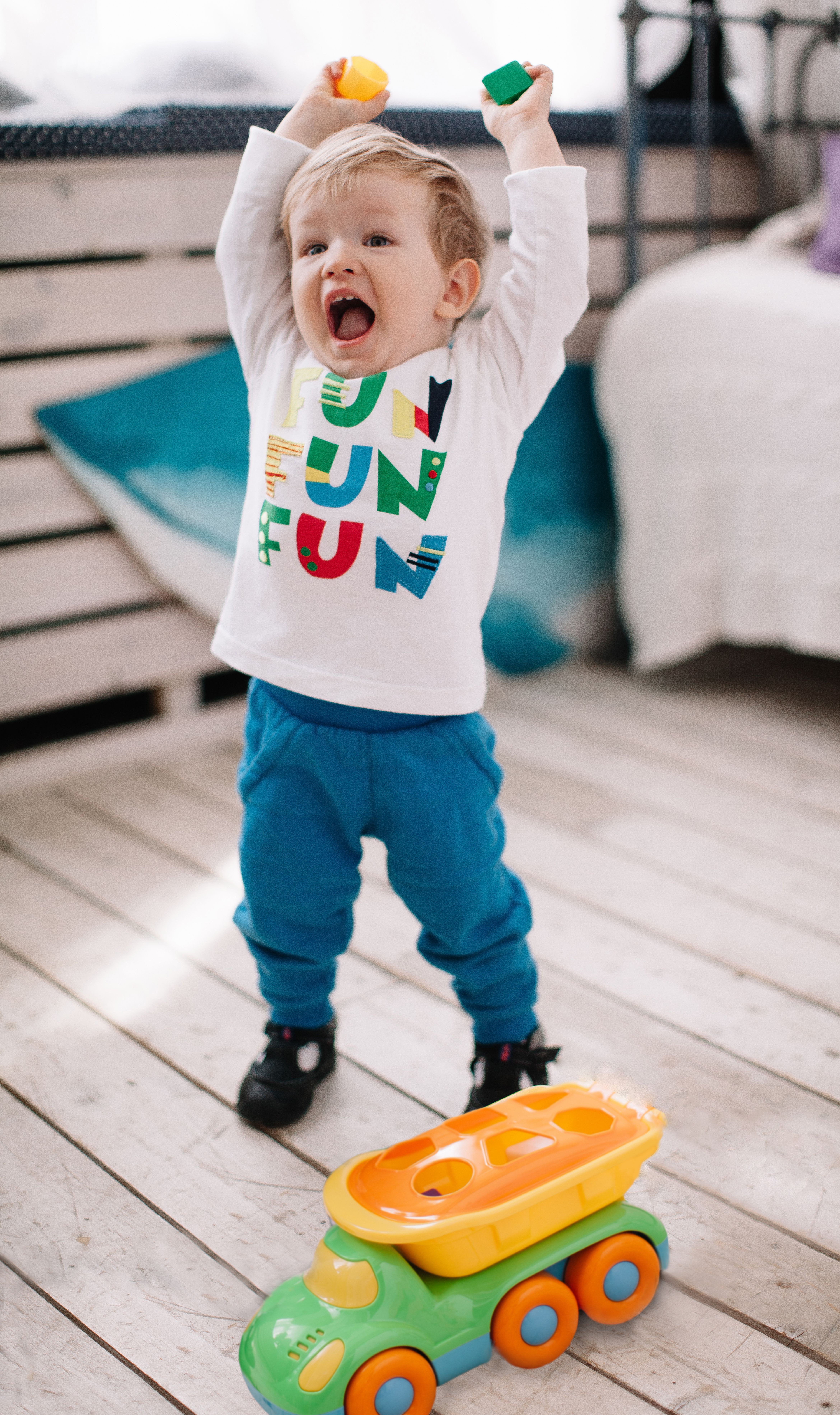 Little Boy Standing with His Arms Raised Up · Free Stock Photo
