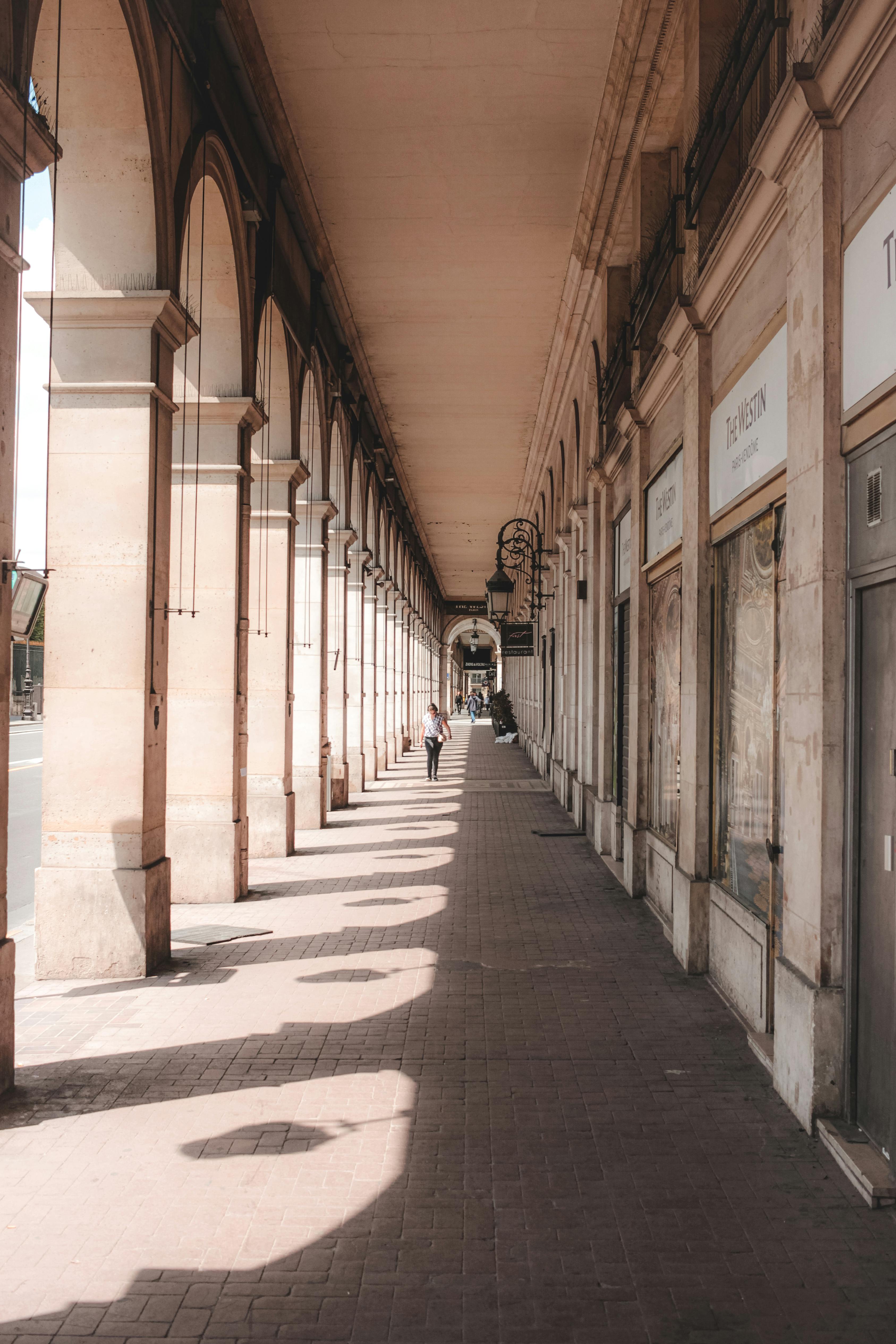 Modern building passageway with arched windows · Free Stock Photo