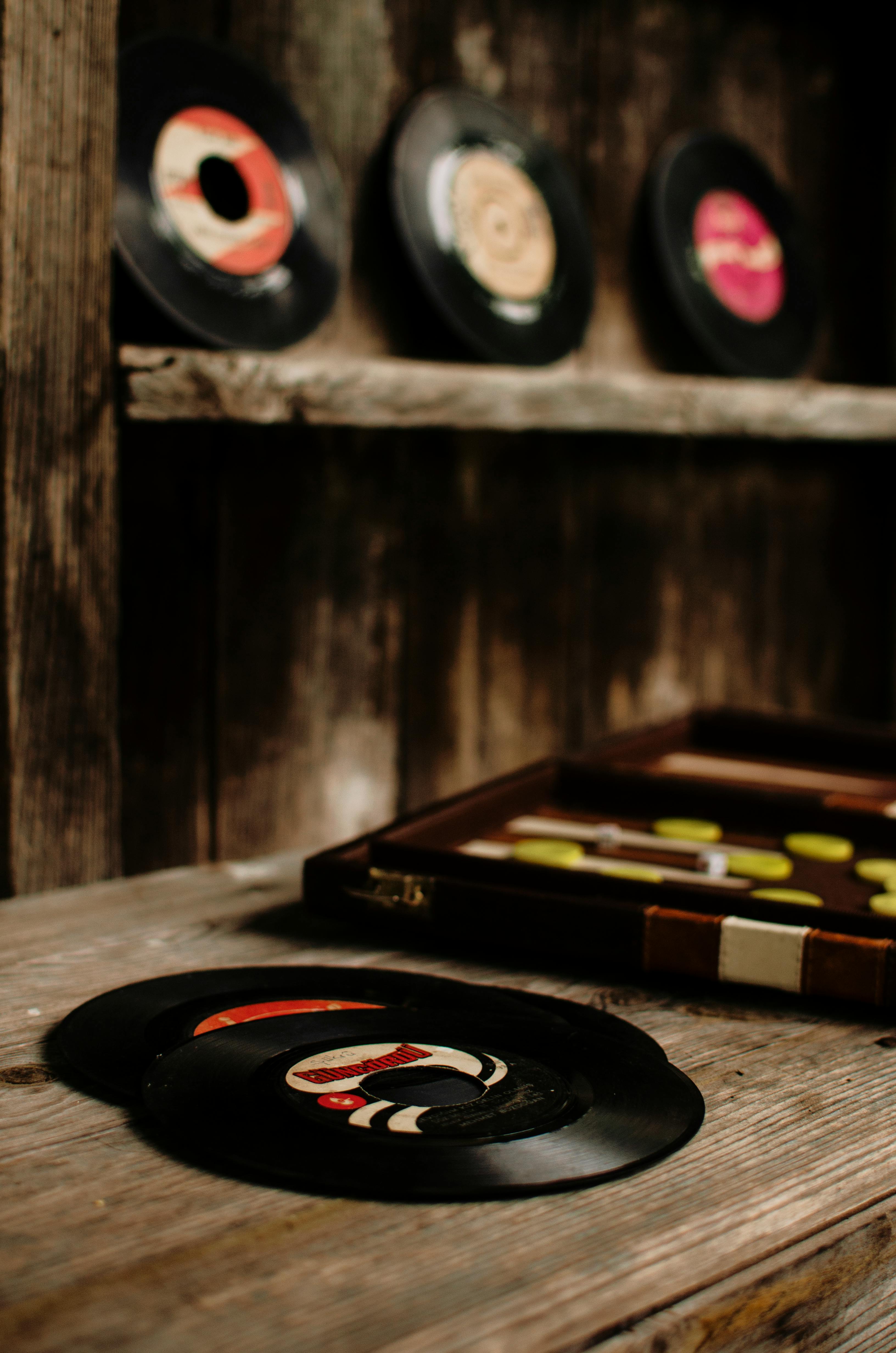 Classic vinyl record placed on wooden table · Free Stock Photo