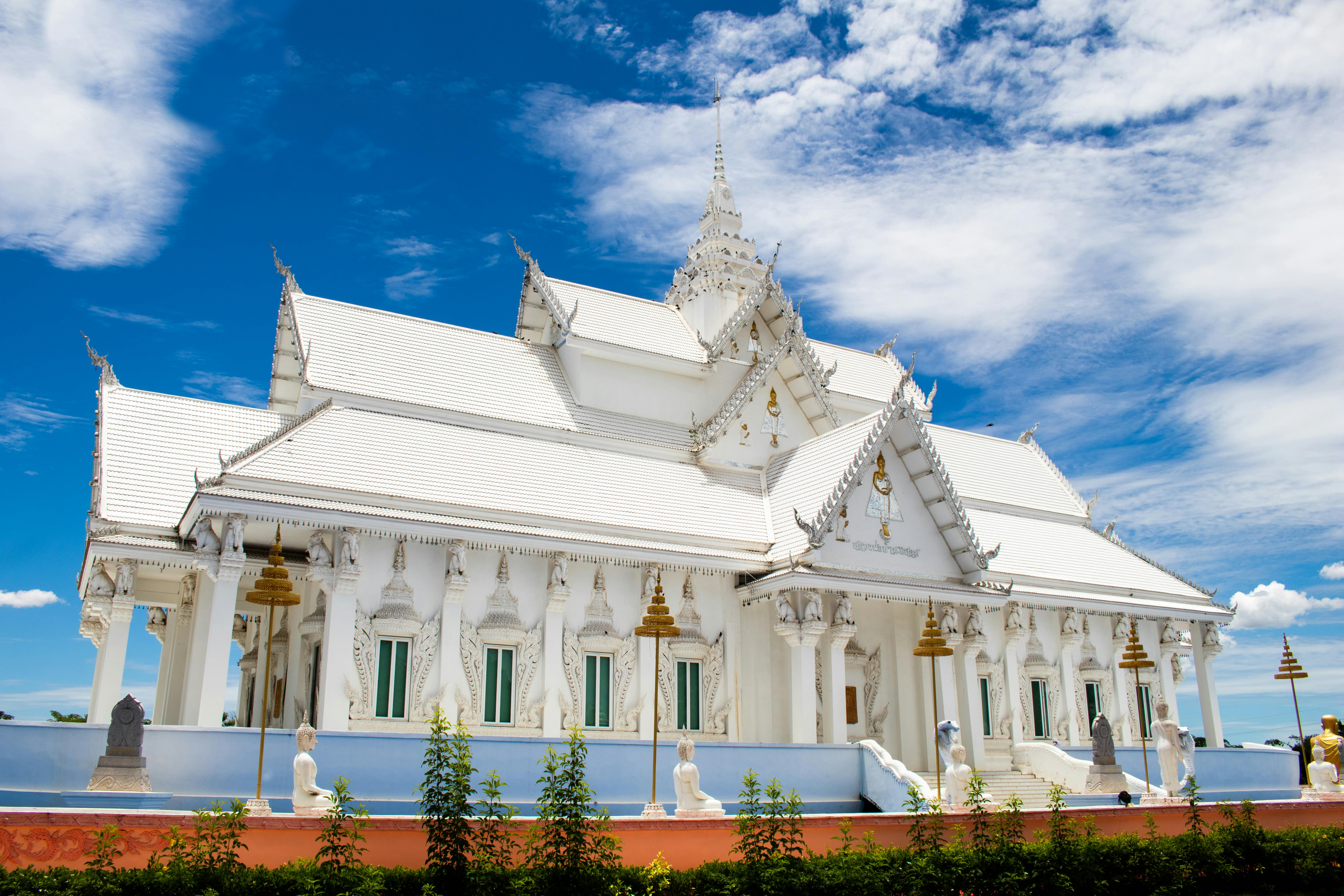 White temple under blue sky with clouds · Free Stock Photo
