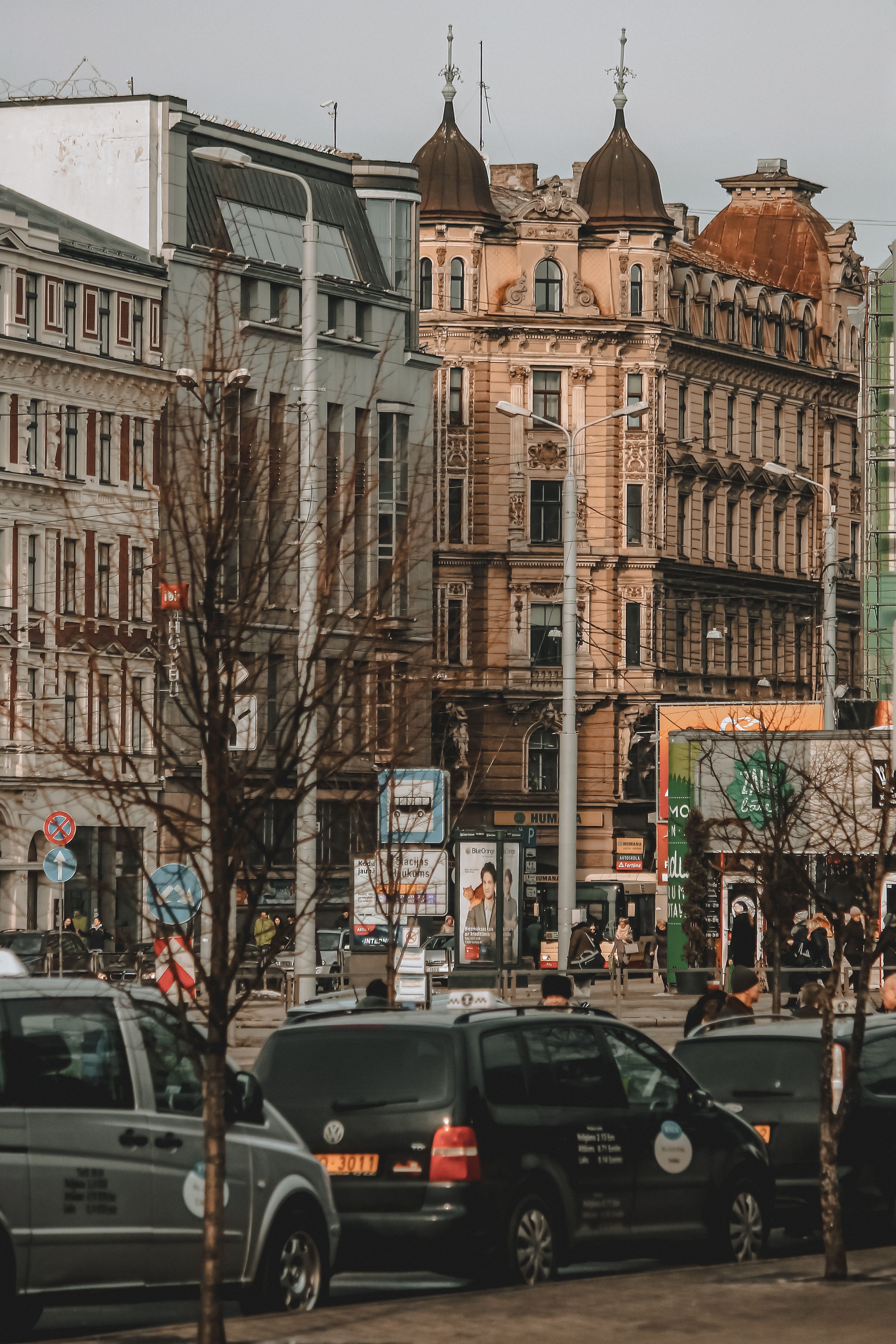 Modern cars on street next to road · Free Stock Photo