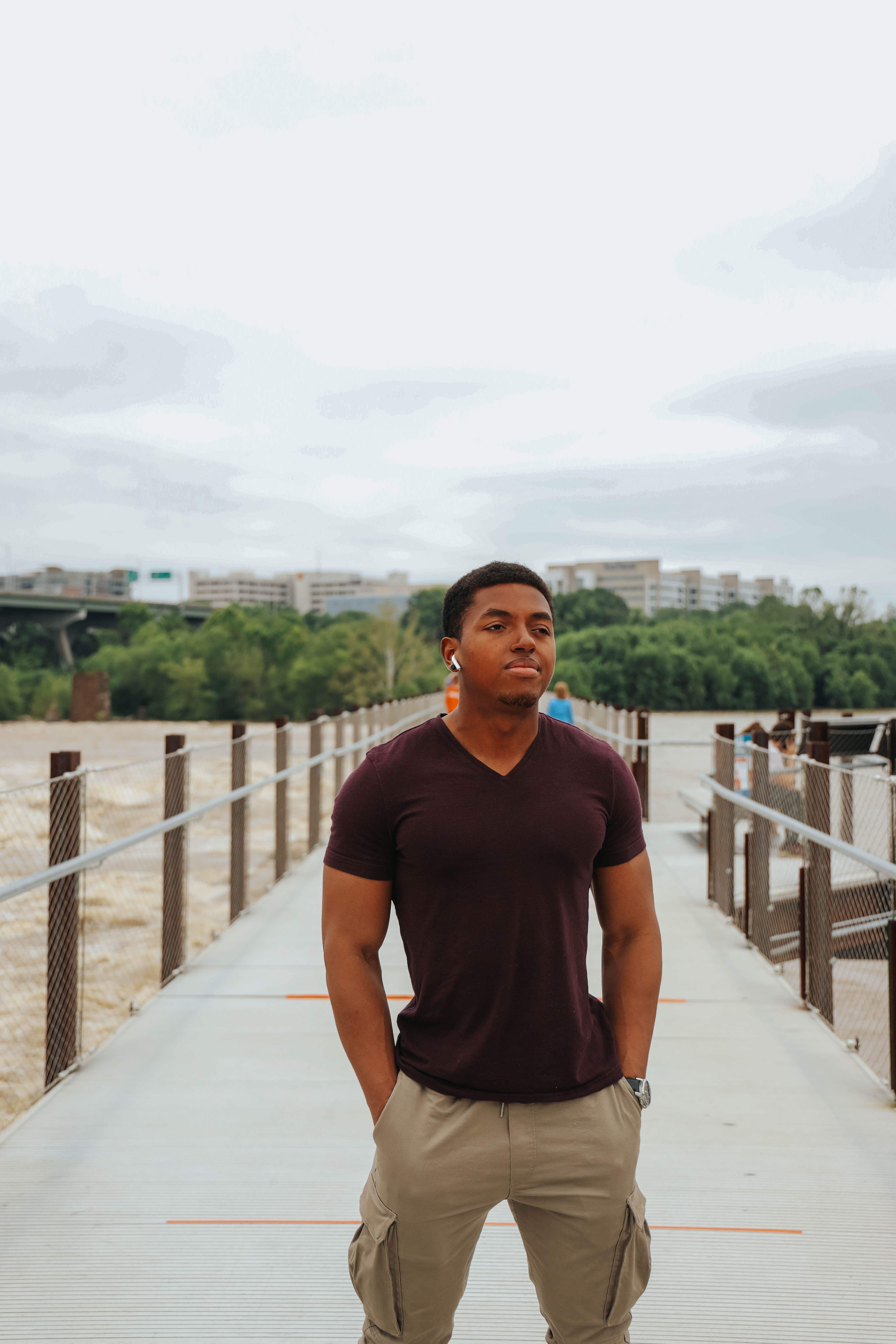 Black man resting on pier · Free Stock Photo