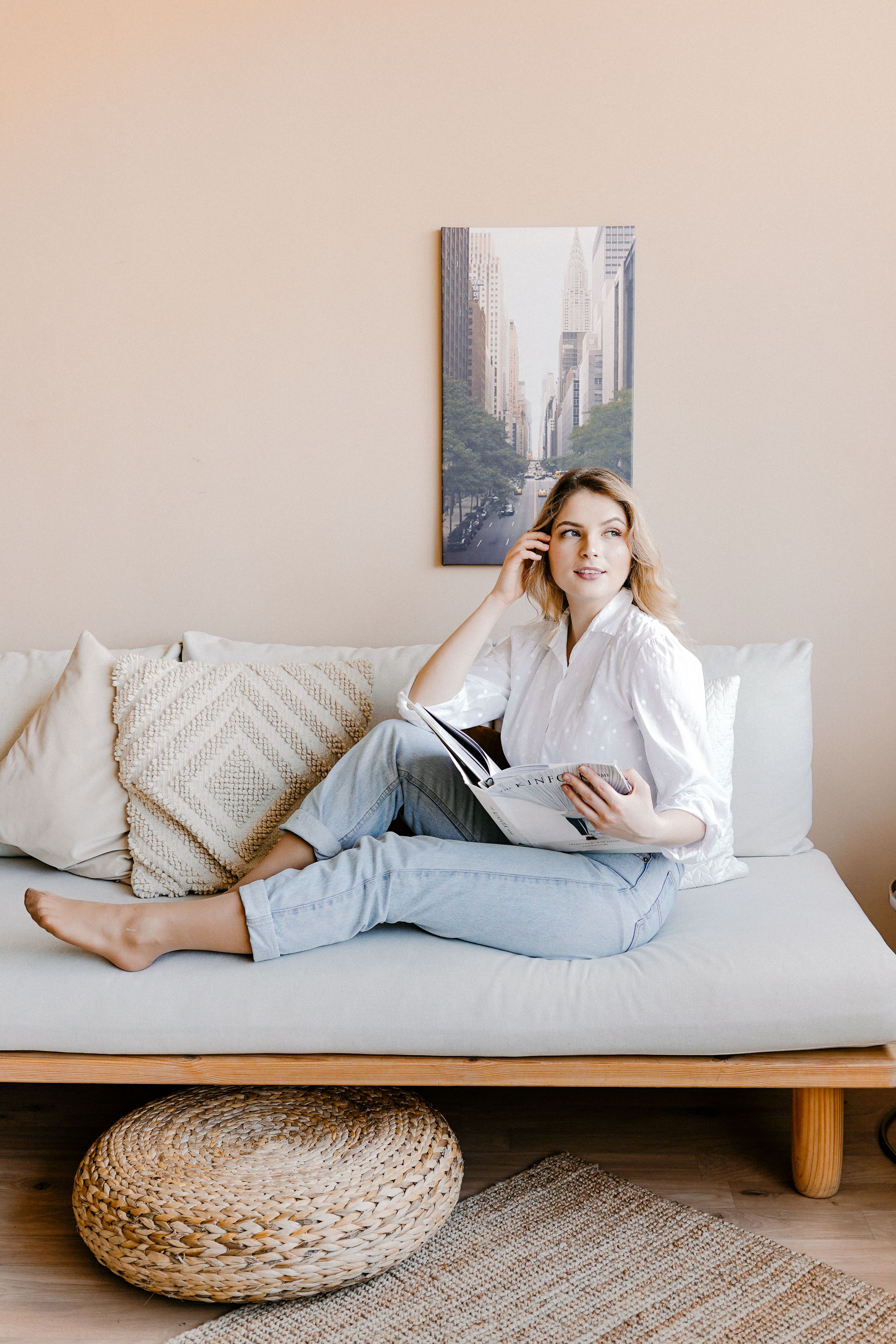 Woman Sitting on a Couch · Free Stock Photo