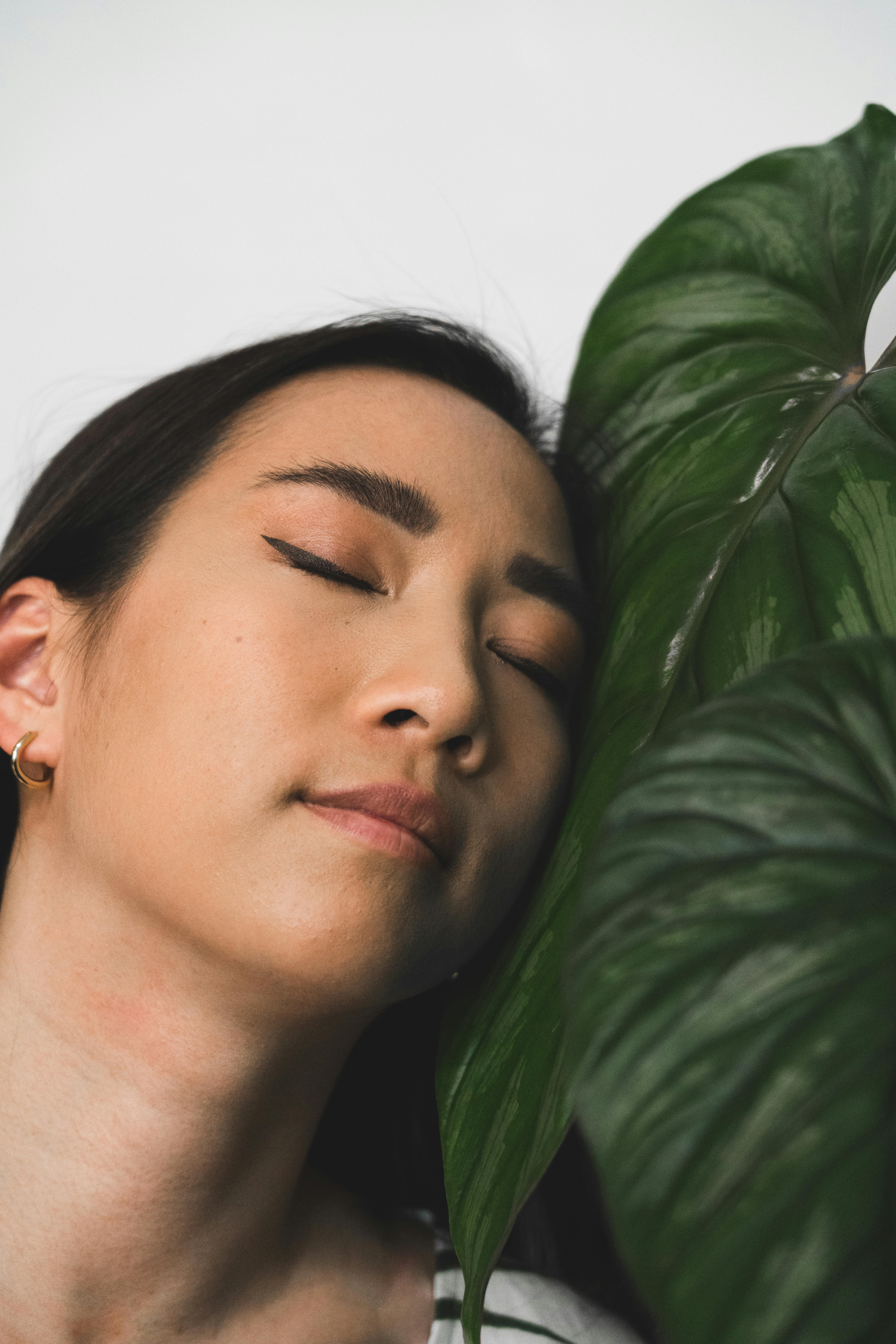 Woman's Face on Green Leaf · Free Stock Photo