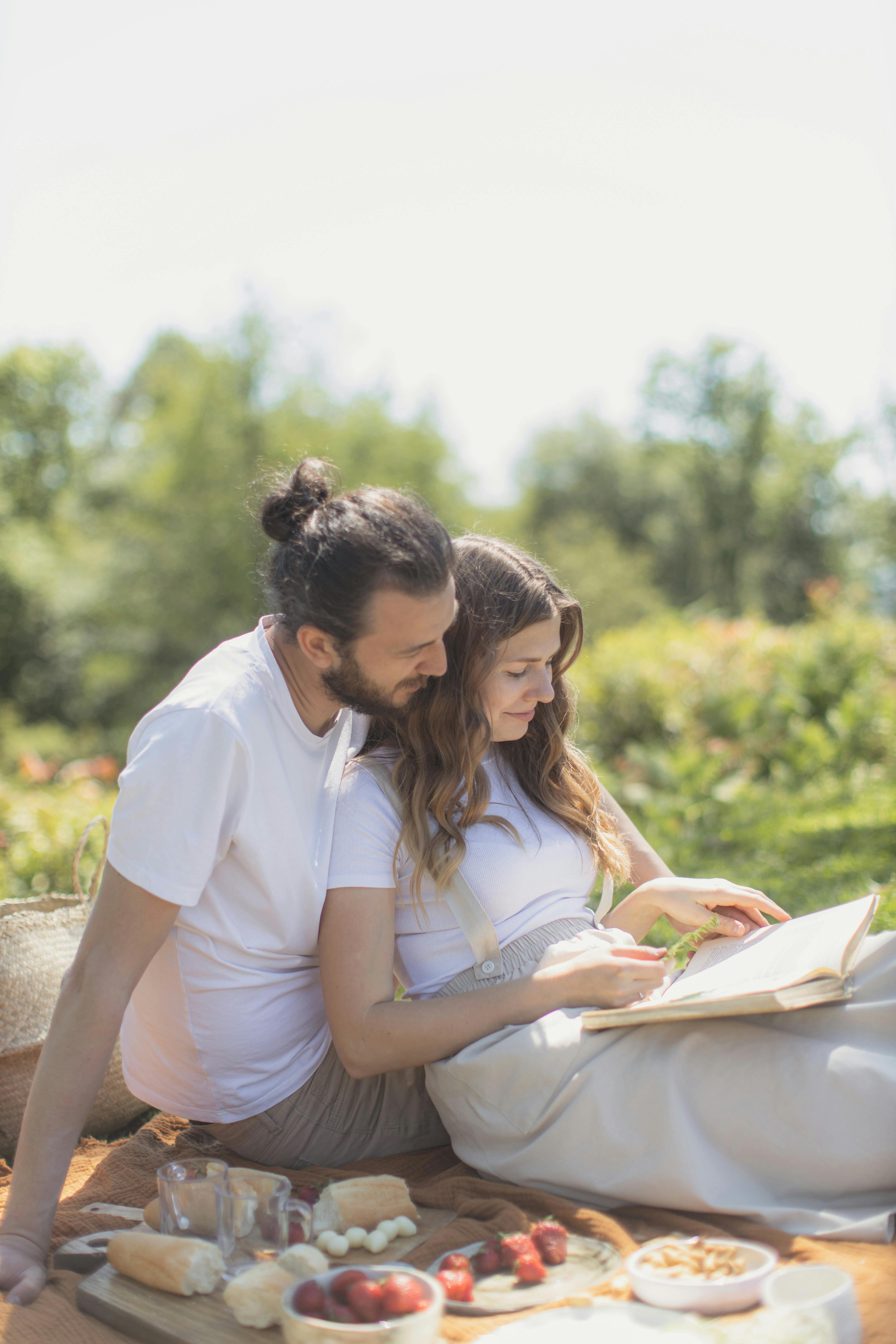 Sweet Couple Reading Book Together · Free Stock Photo