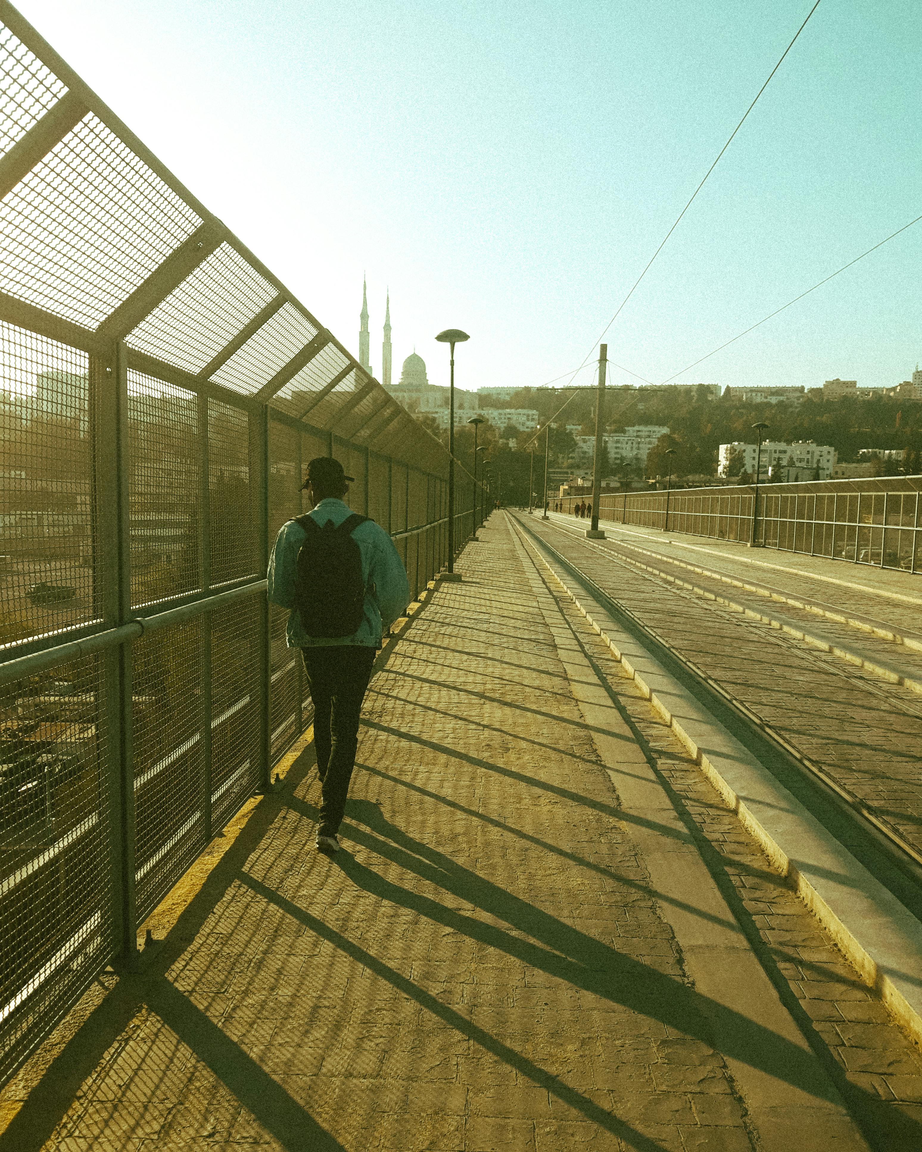 Photo of People Walking on Footbridge · Free Stock Photo