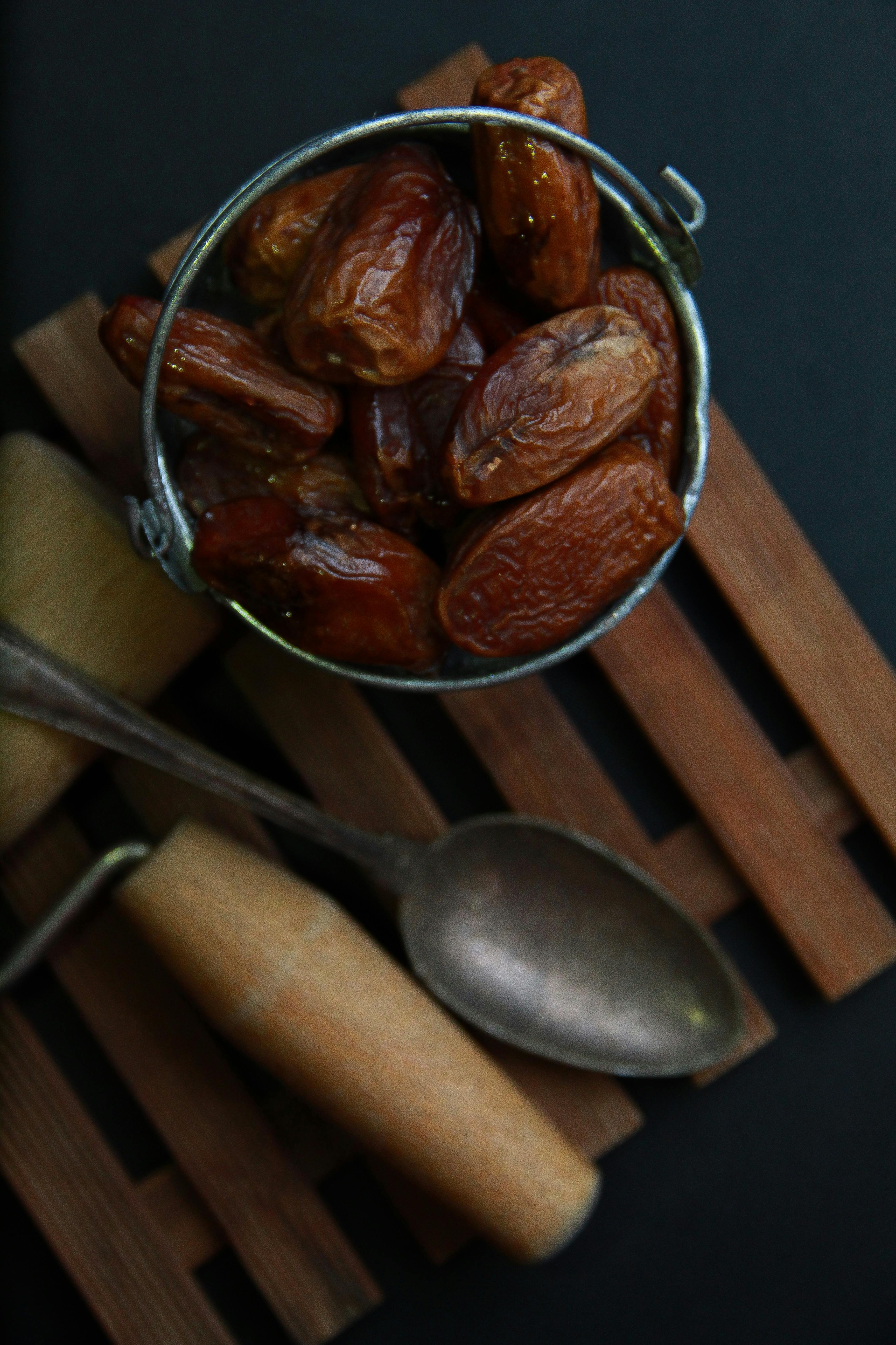A Bunch of Dates on Stainless Bucket · Free Stock Photo