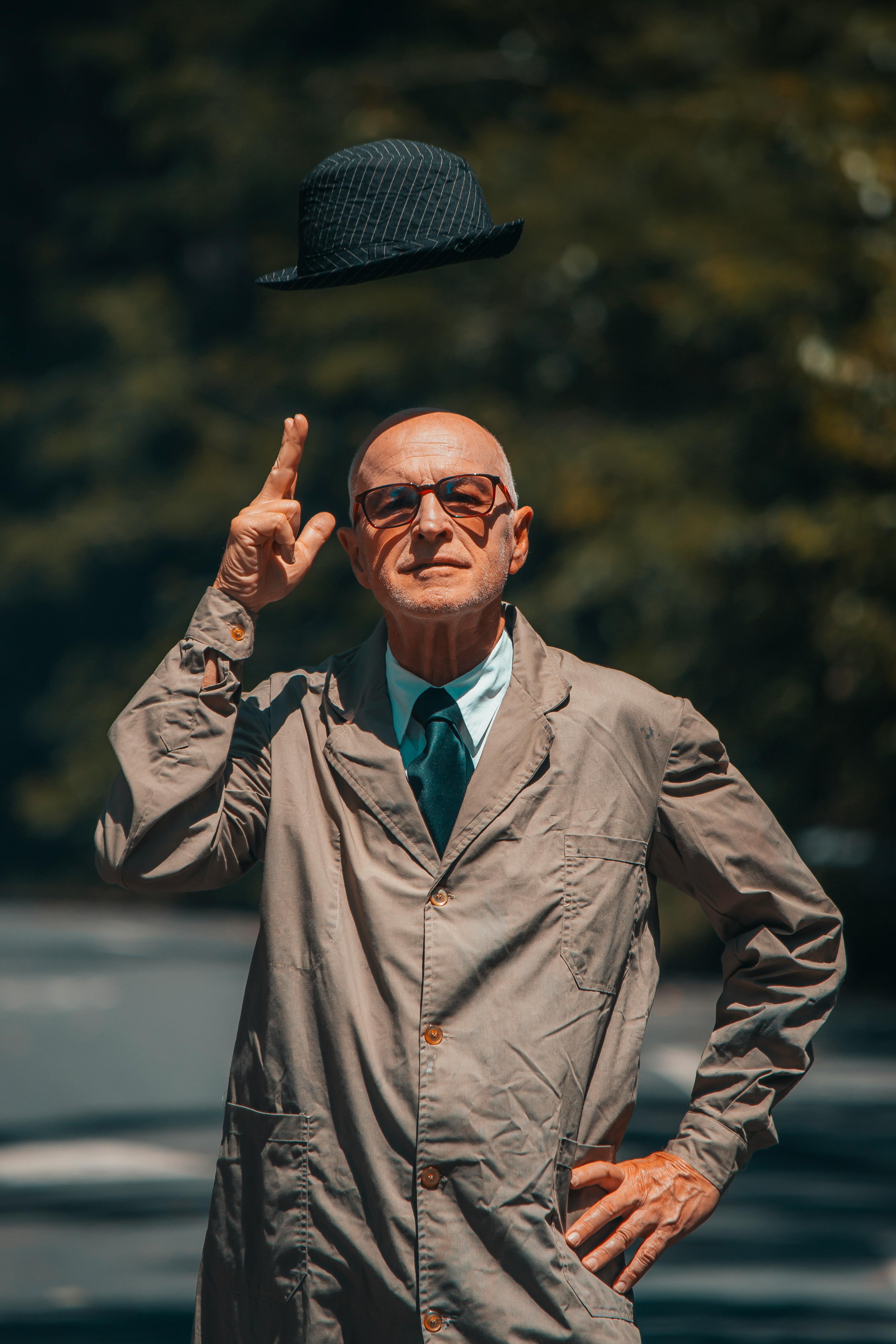 Hat Floating Above Man's Head · Free Stock Photo
