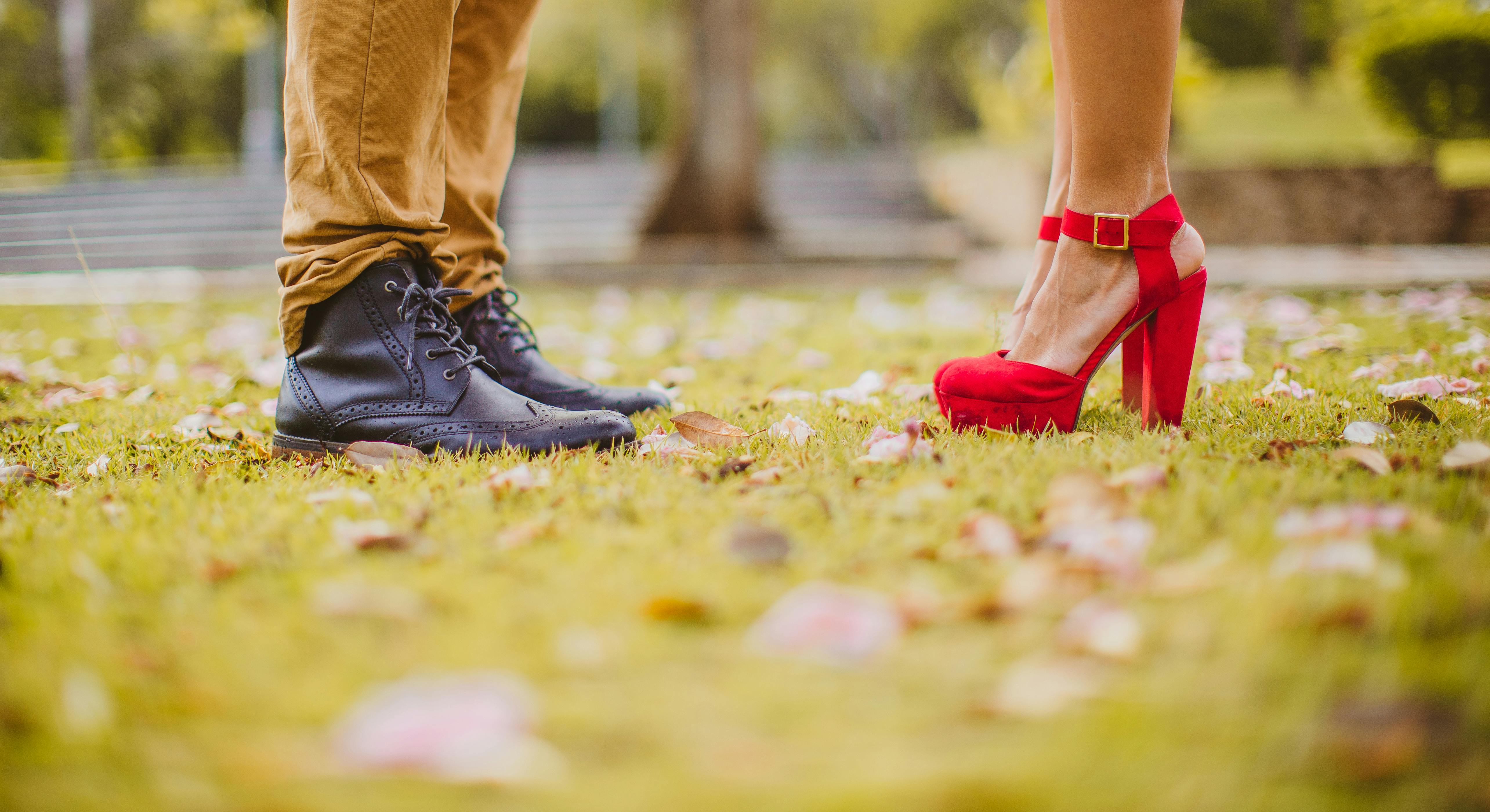 Photo of Two Person Standing on Grass Field · Free Stock Photo
