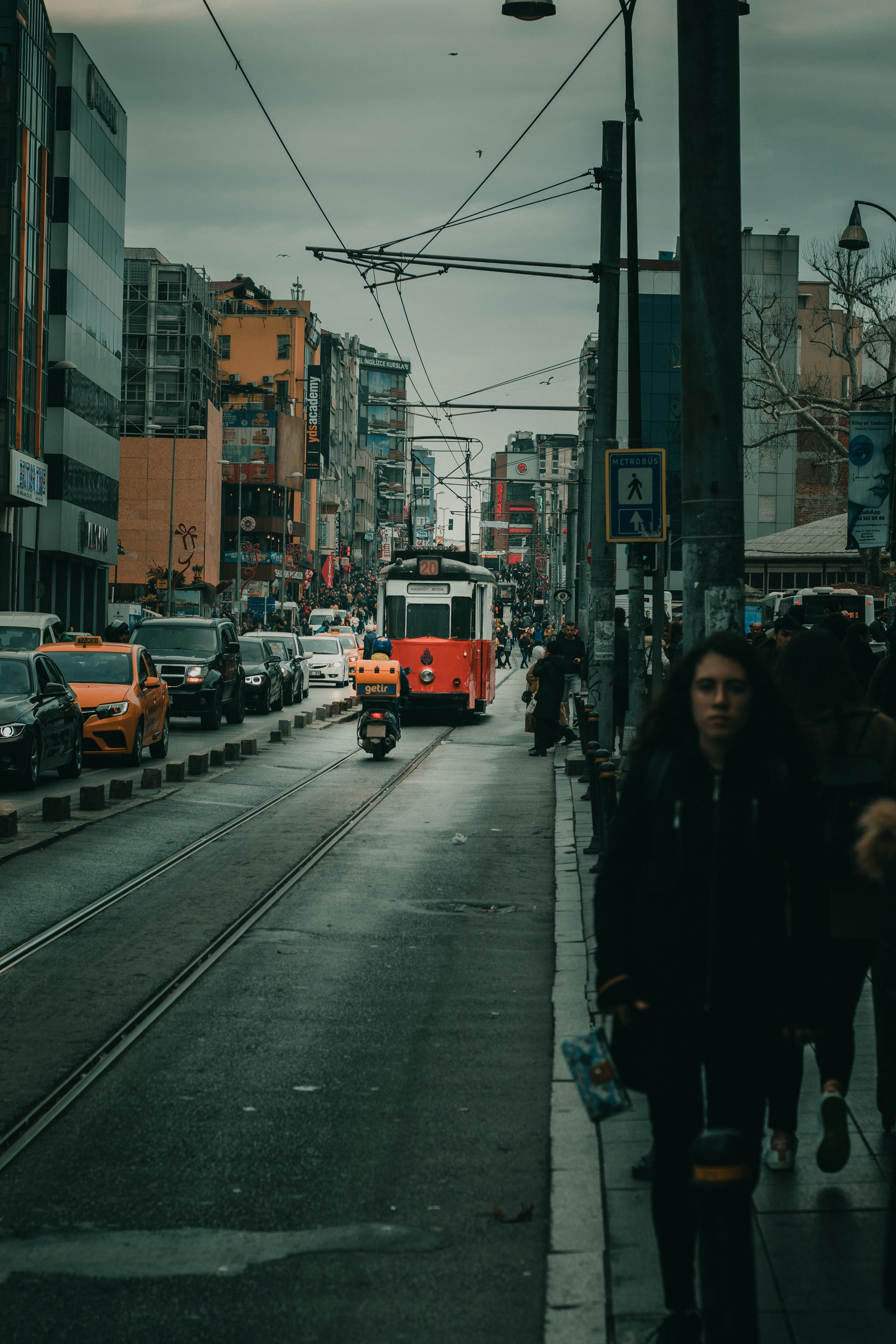Pedestrians and vehicles in city · Free Stock Photo