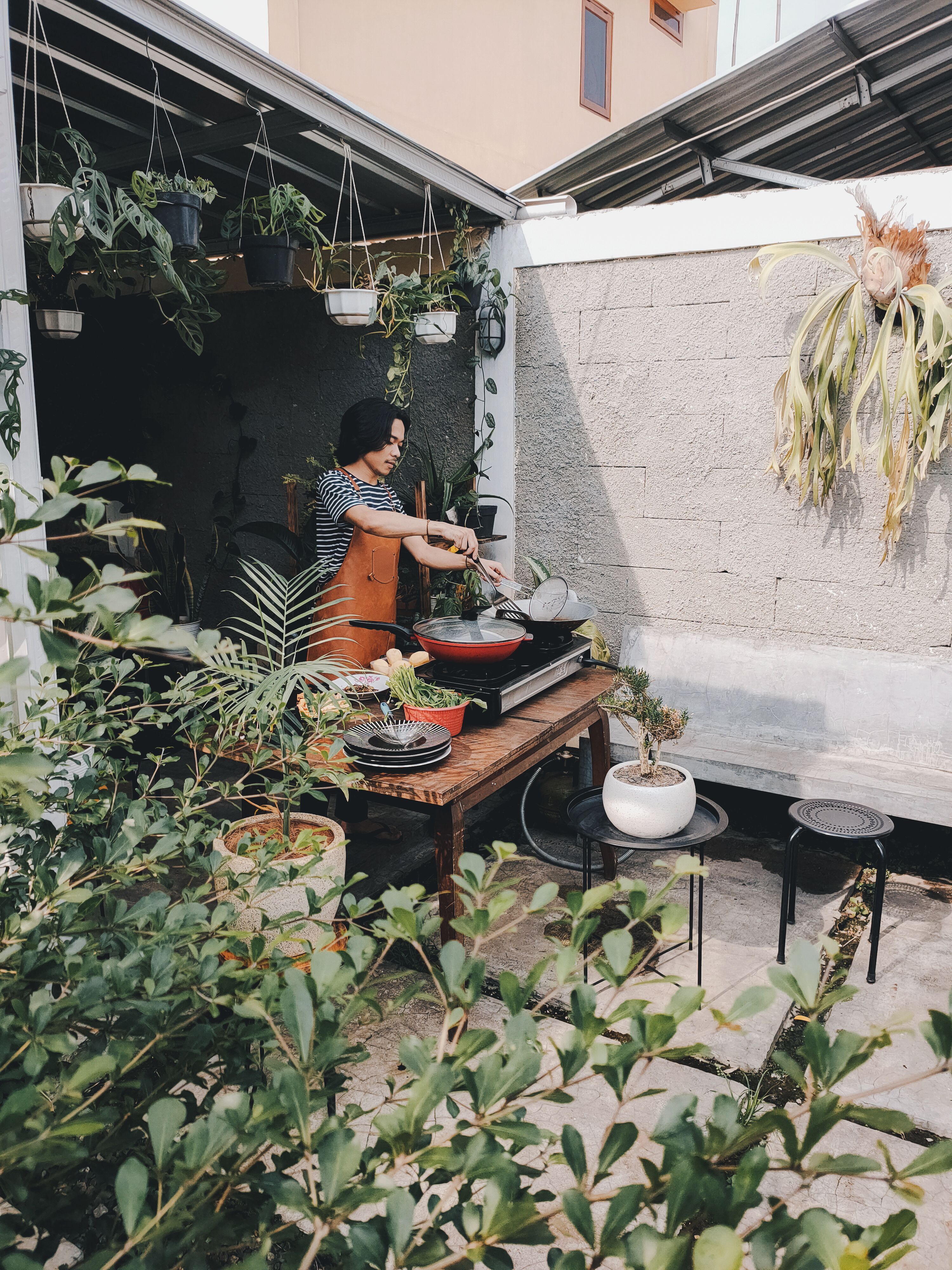 A Man Cooking in The Backyard · Free Stock Photo