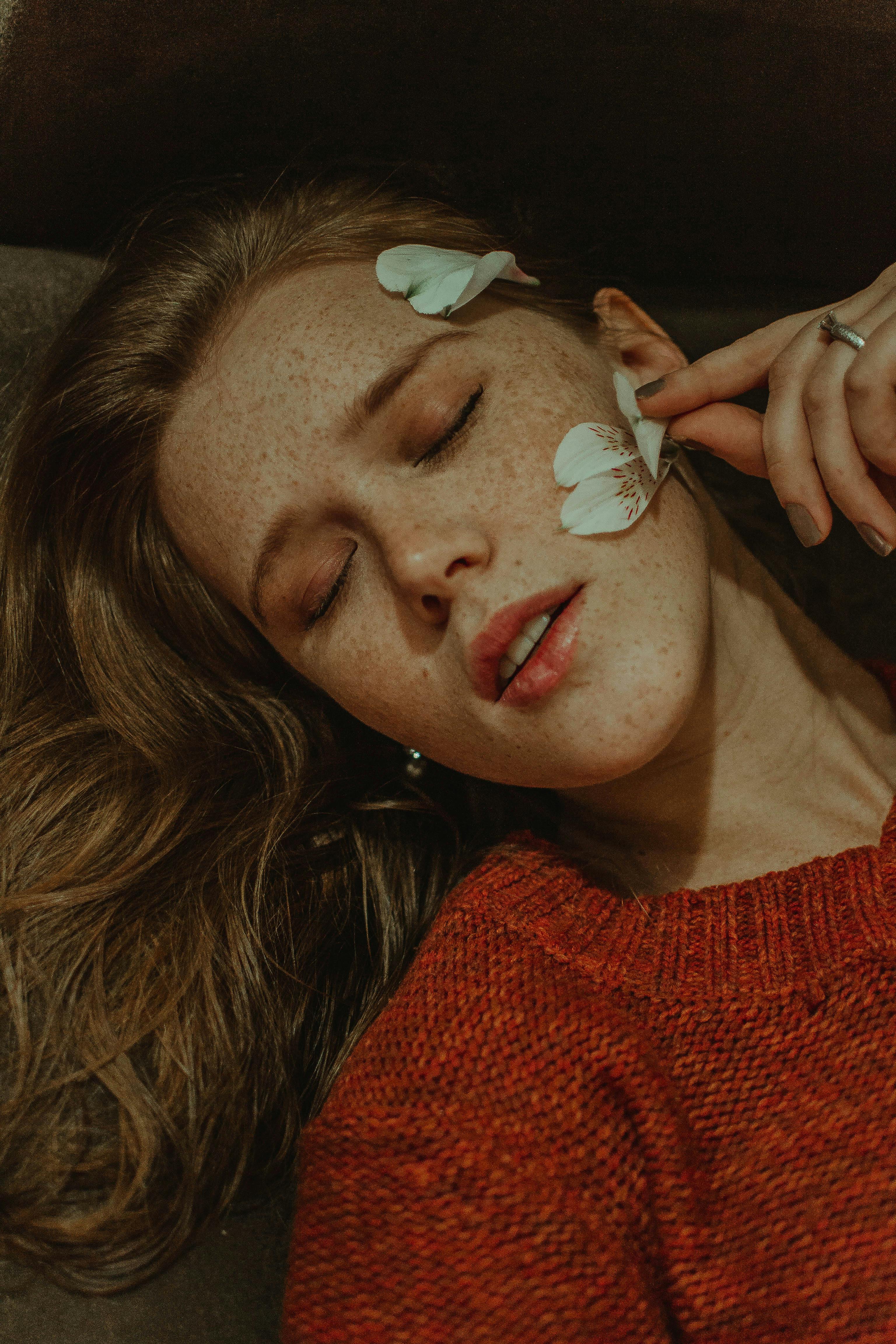 Romantic woman with petals on face · Free Stock Photo