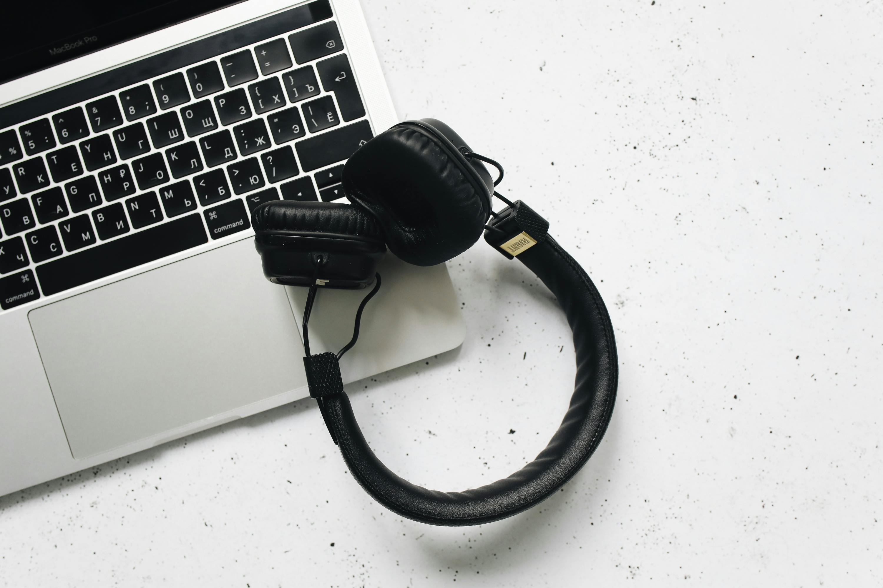 Black Headphones on Macbook Pro Laptop · Free Stock Photo