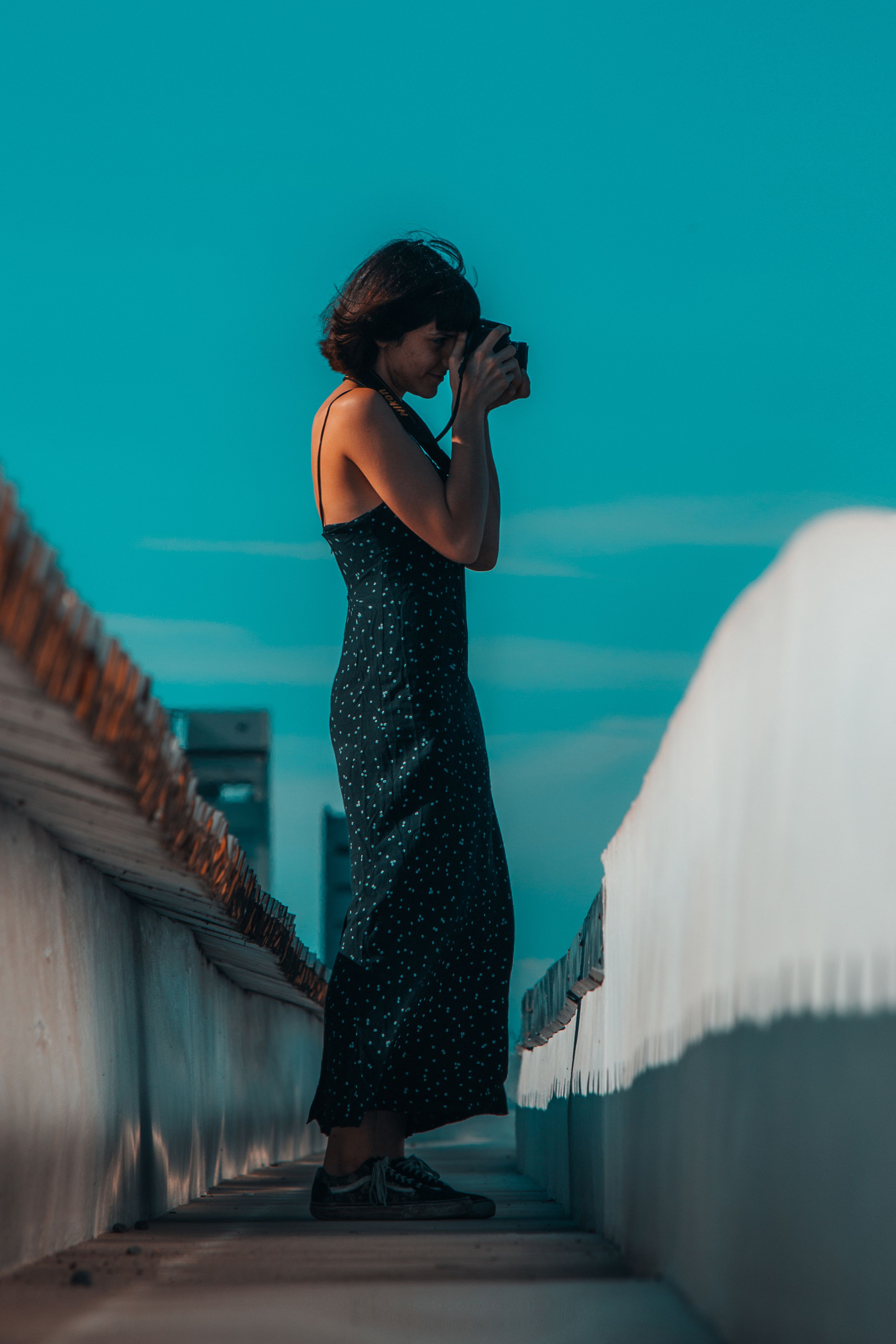 Woman in a Dress Holding a Polaroid Camera · Free Stock Photo