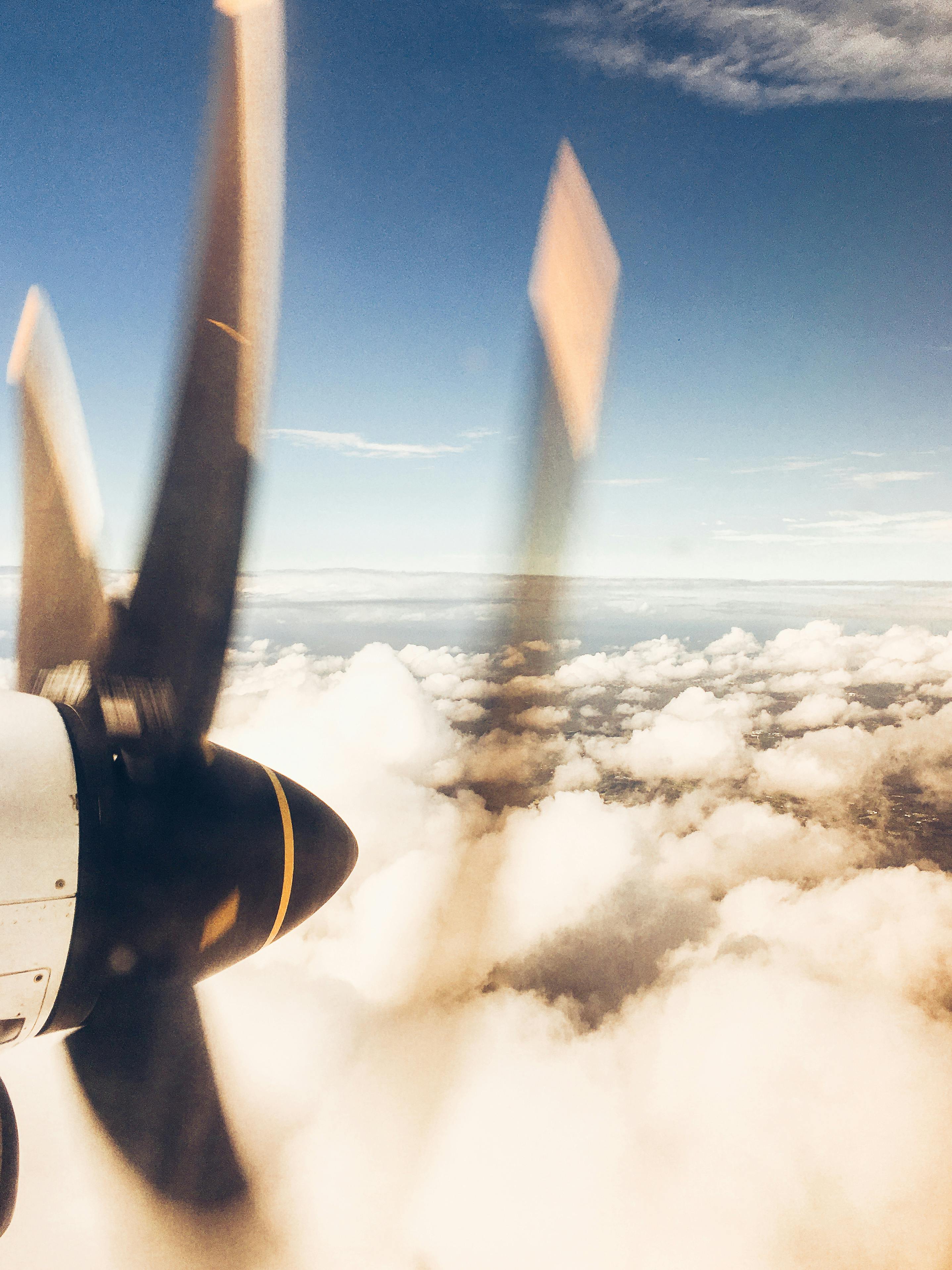 Chrome Airplane Flying during Daytime · Free Stock Photo