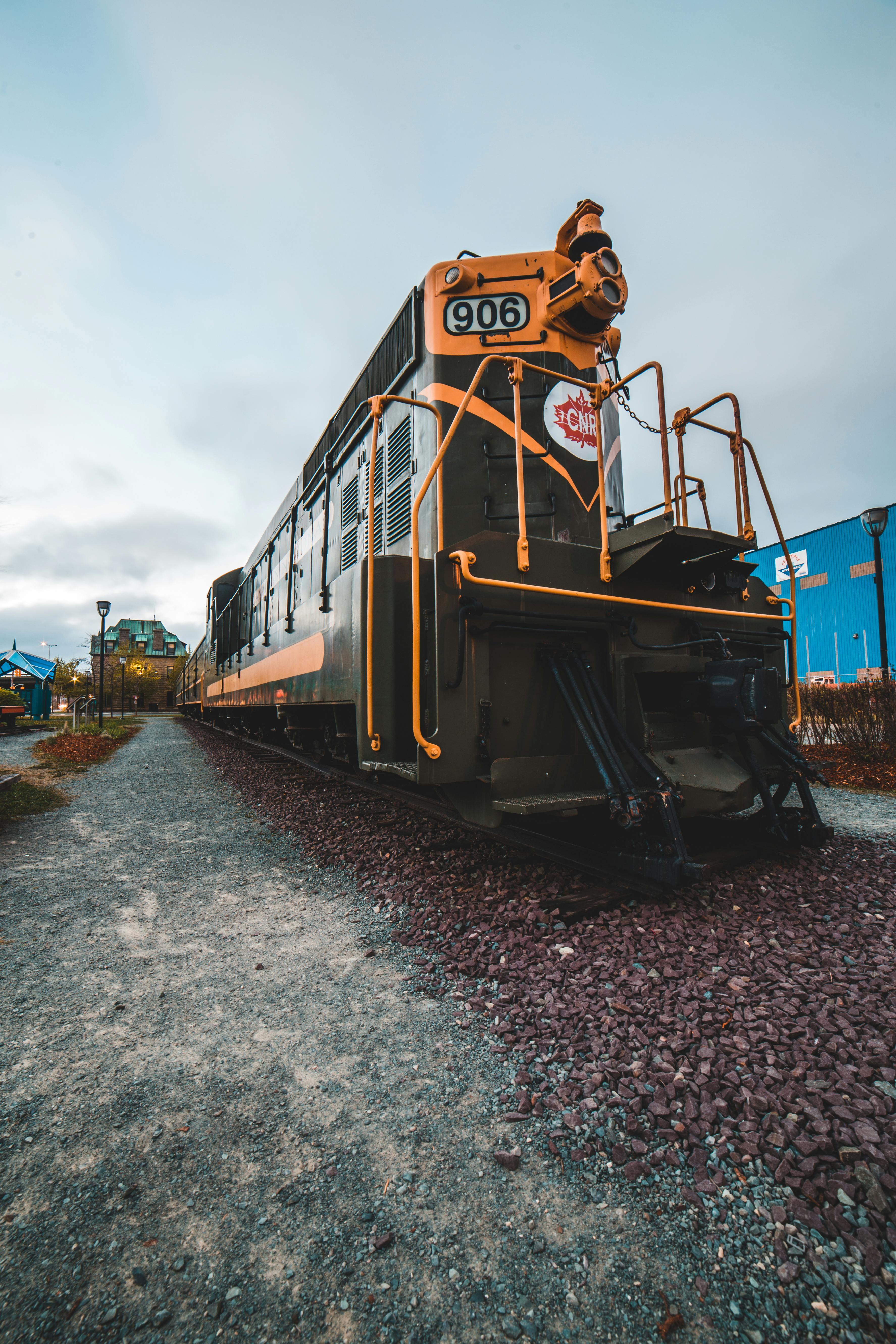 Train on Railroad Tracks Against Sky · Free Stock Photo