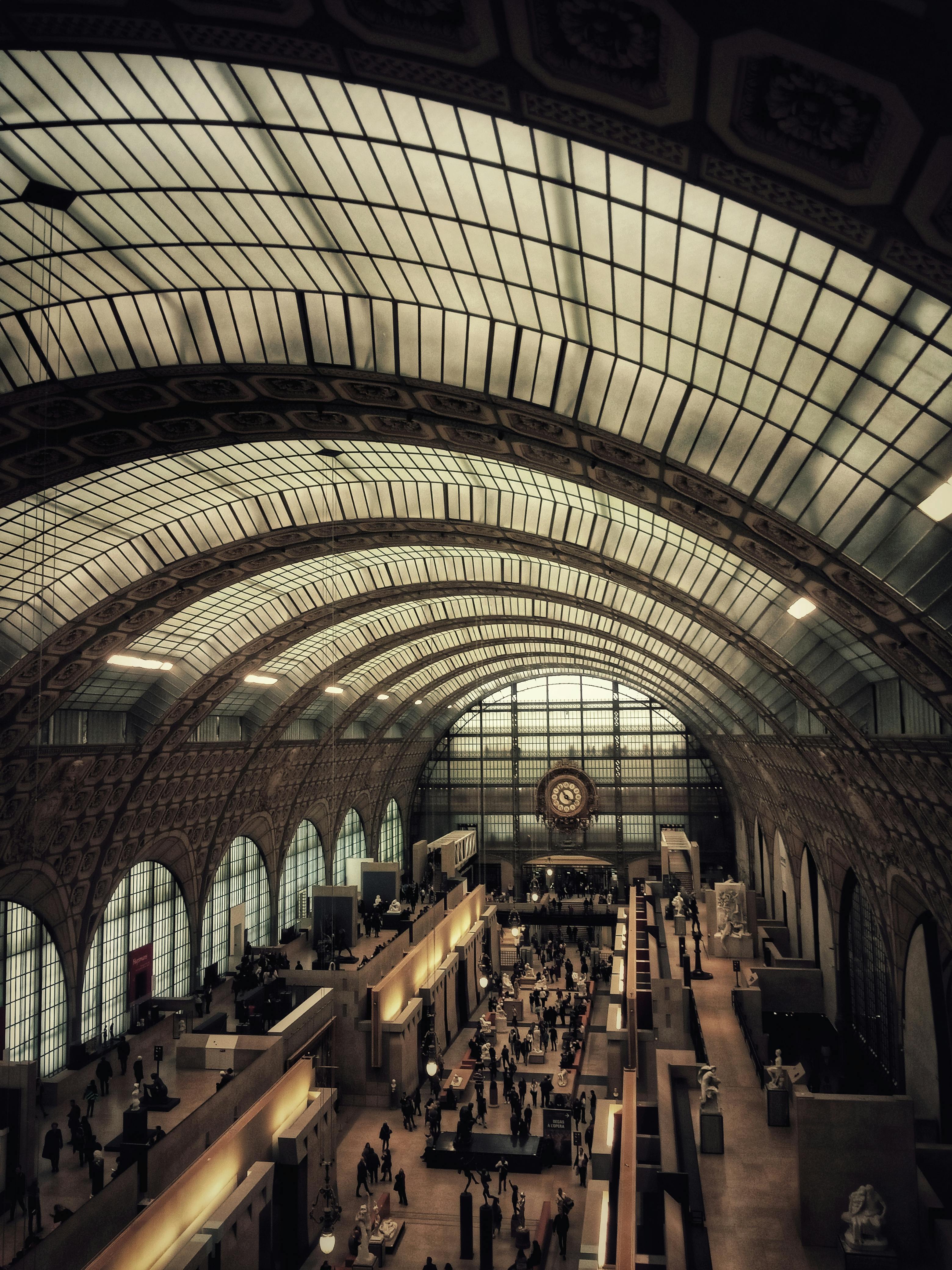 Arched ceiling of old museum with tourists · Free Stock Photo