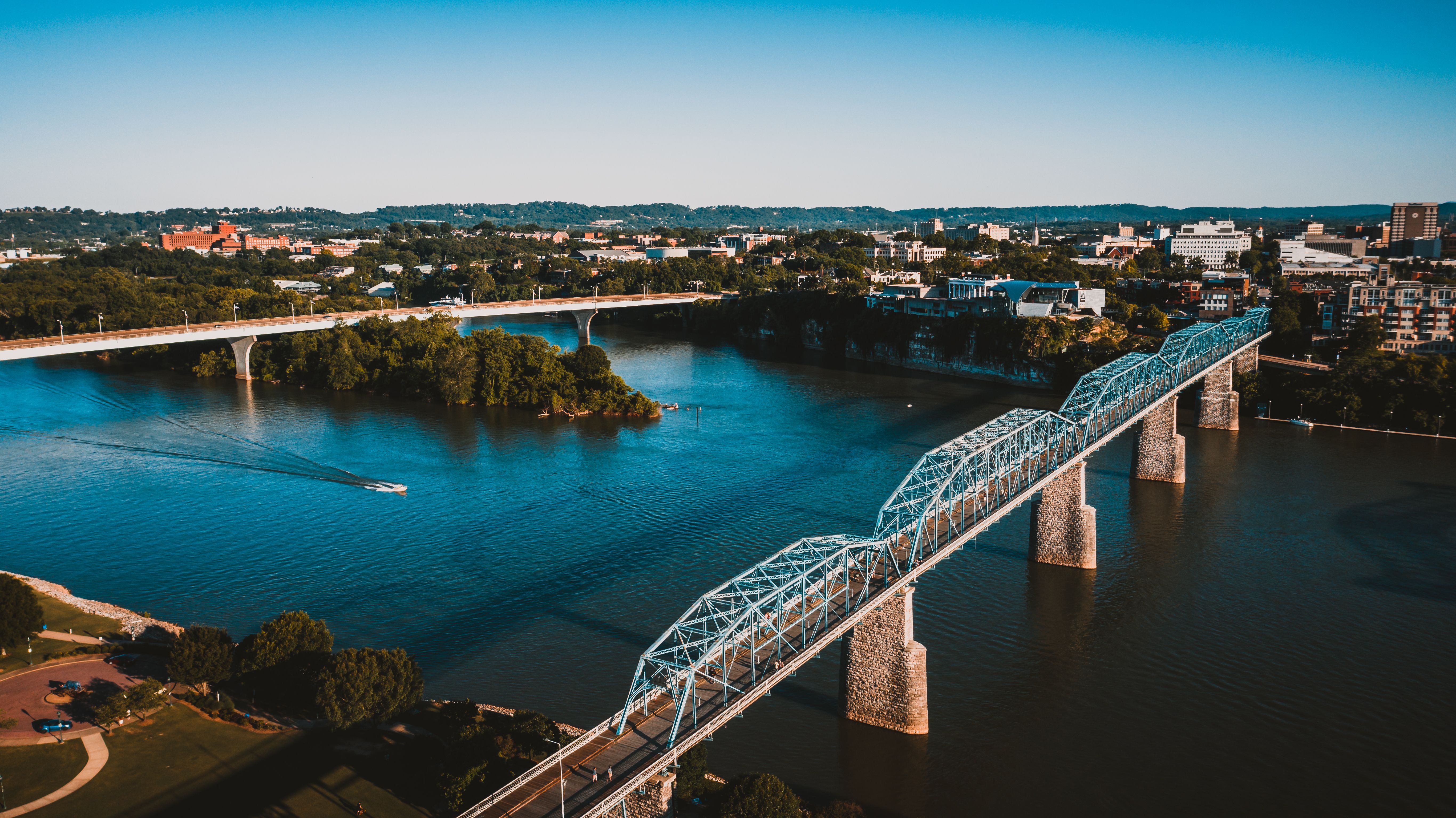 Bridge over blue river at daytime · Free Stock Photo