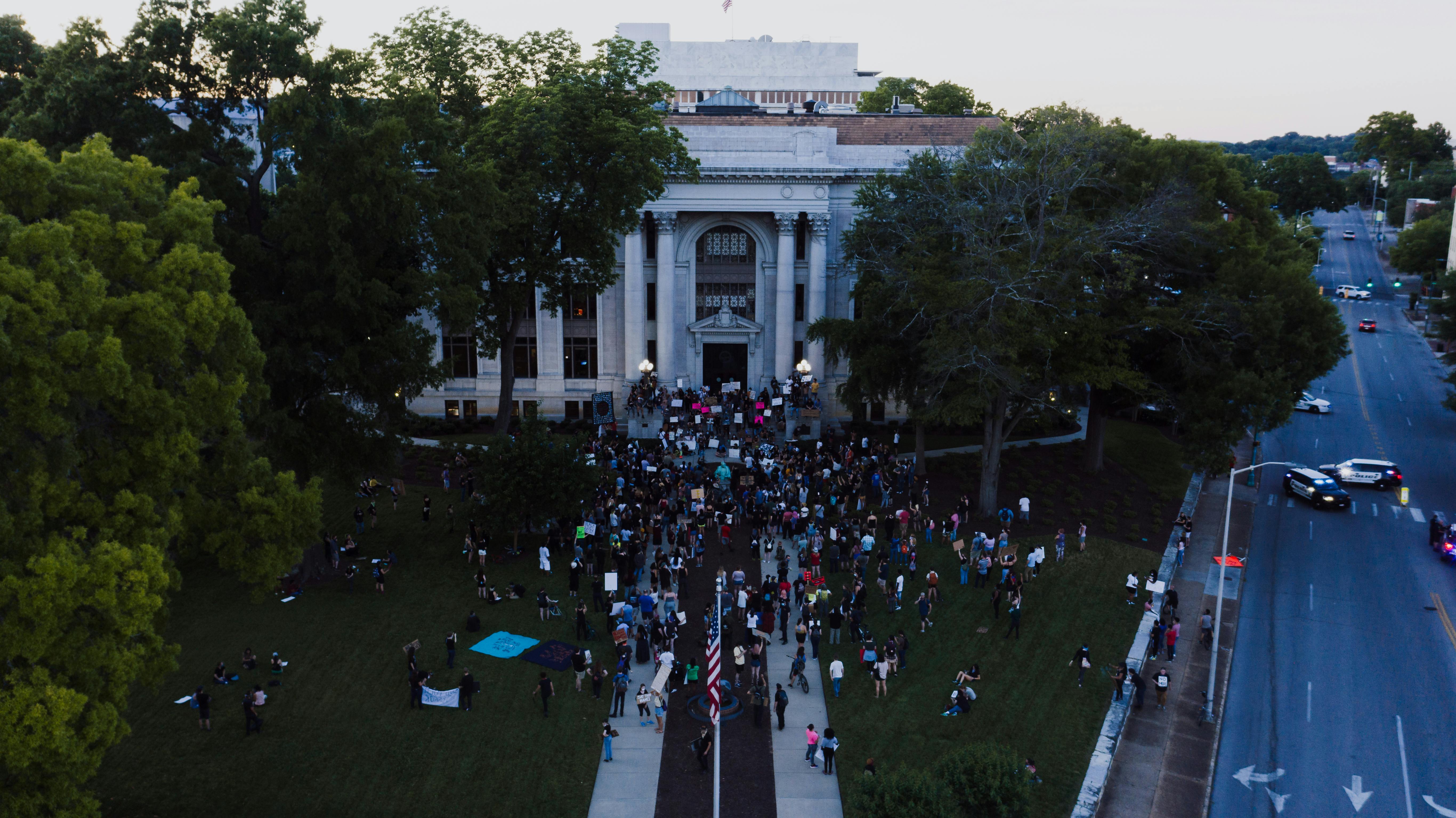 Protesters Gathered in front of a Building · Free Stock Photo