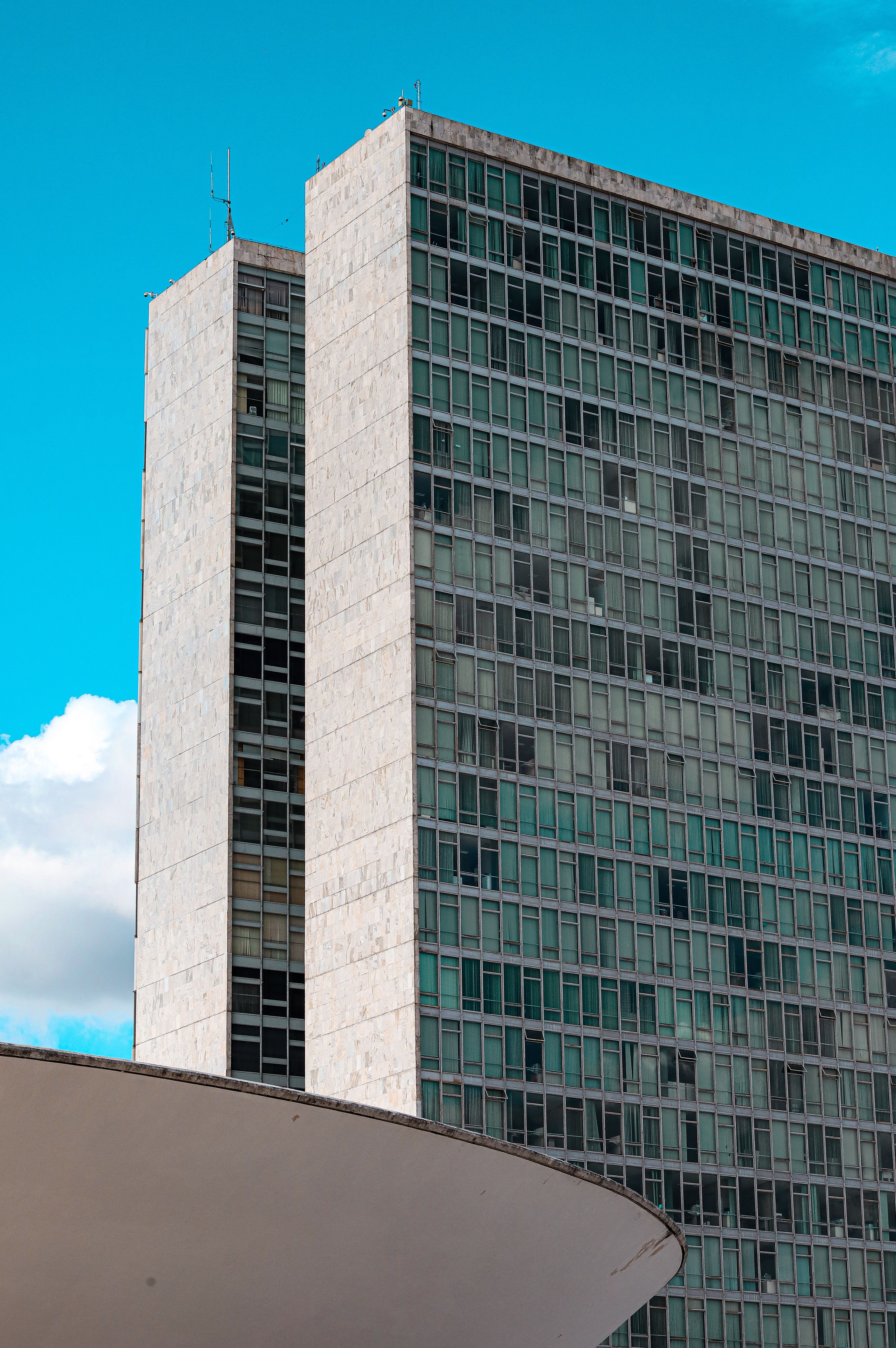 Same buildings and round decorative construction · Free Stock Photo