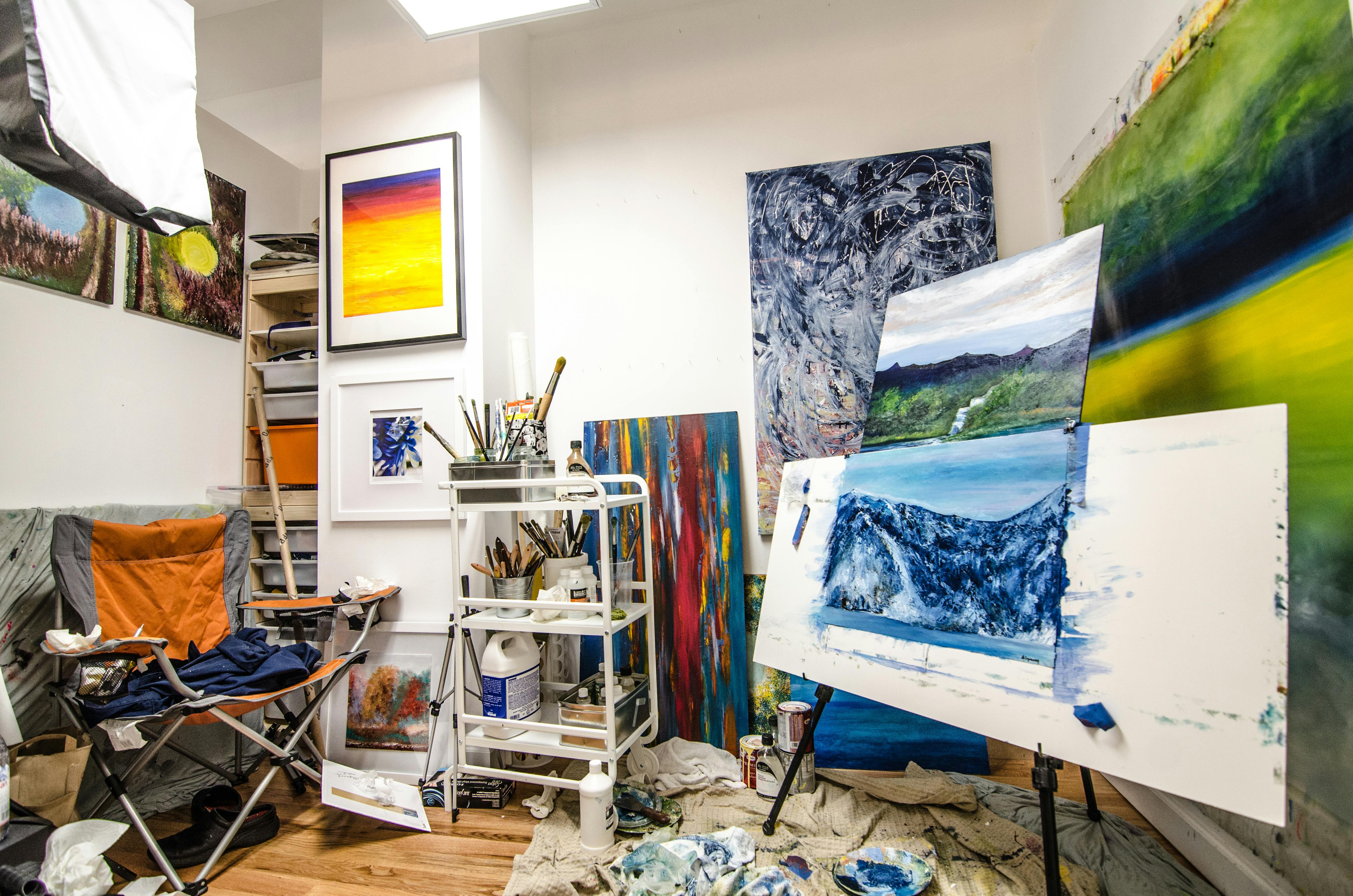 Artists Studio with Paintings and Paintbrushes · Free Stock Photo