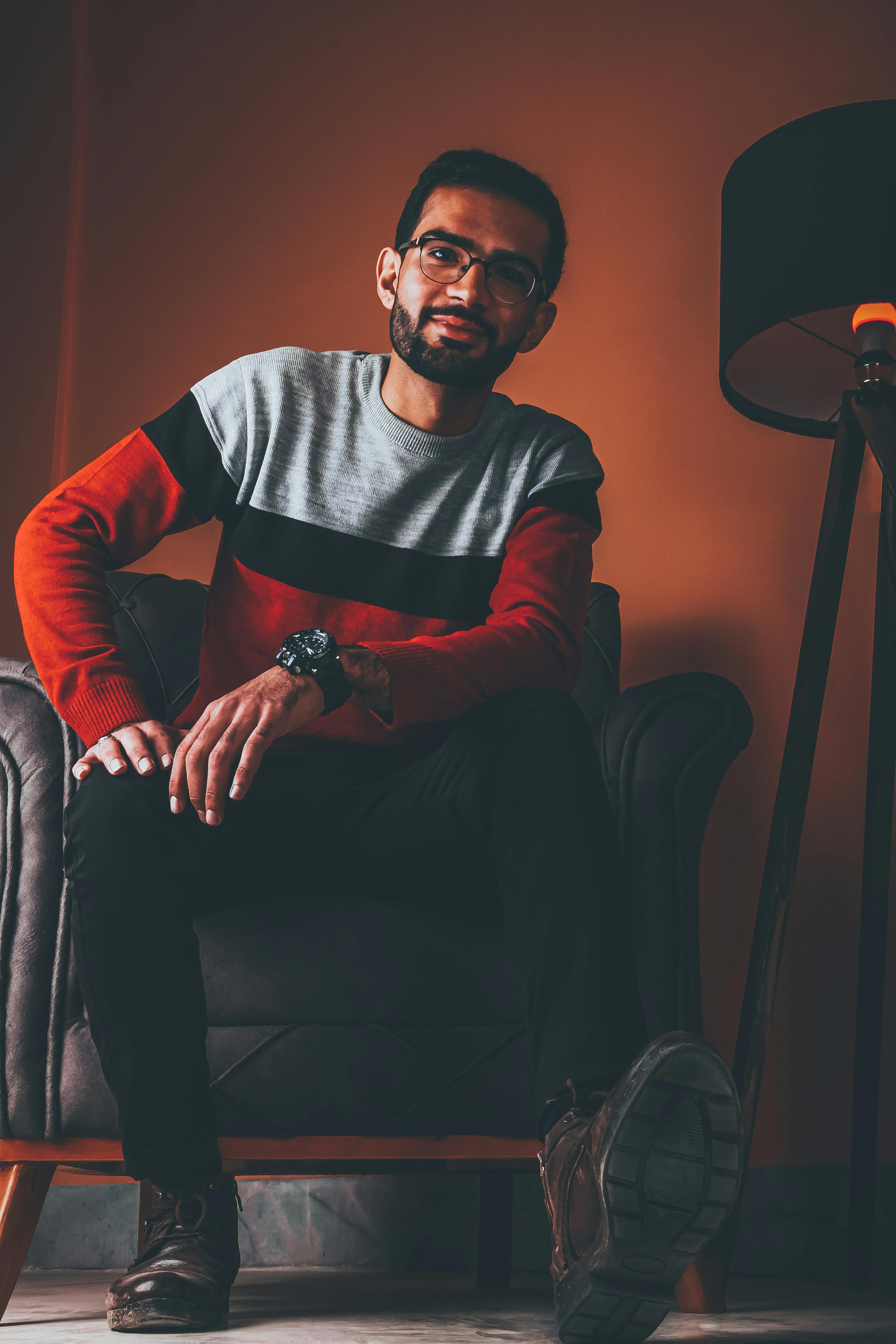 Man Touching a Shining Lamp · Free Stock Photo