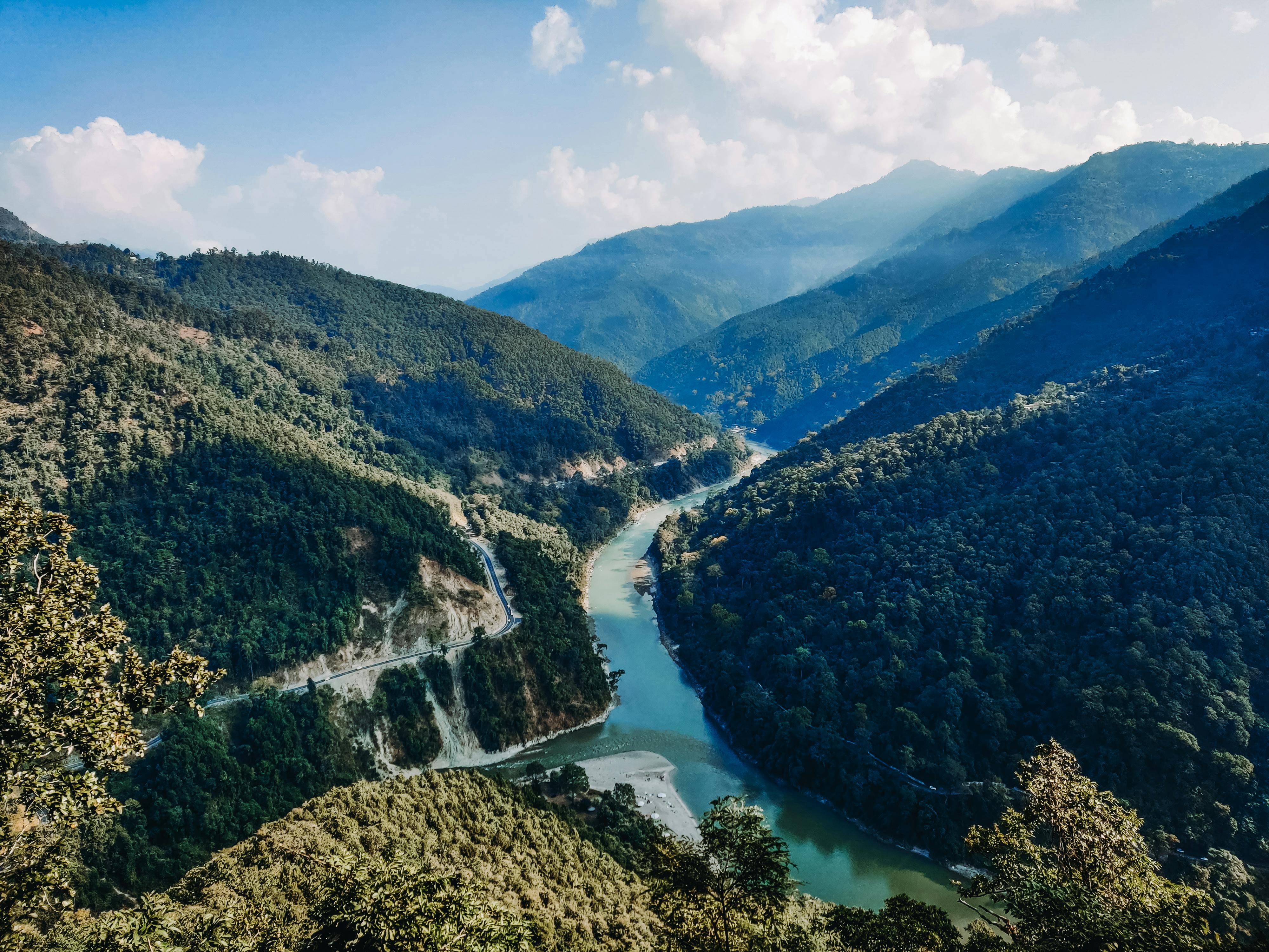 River in Forest Covered Mountains · Free Stock Photo
