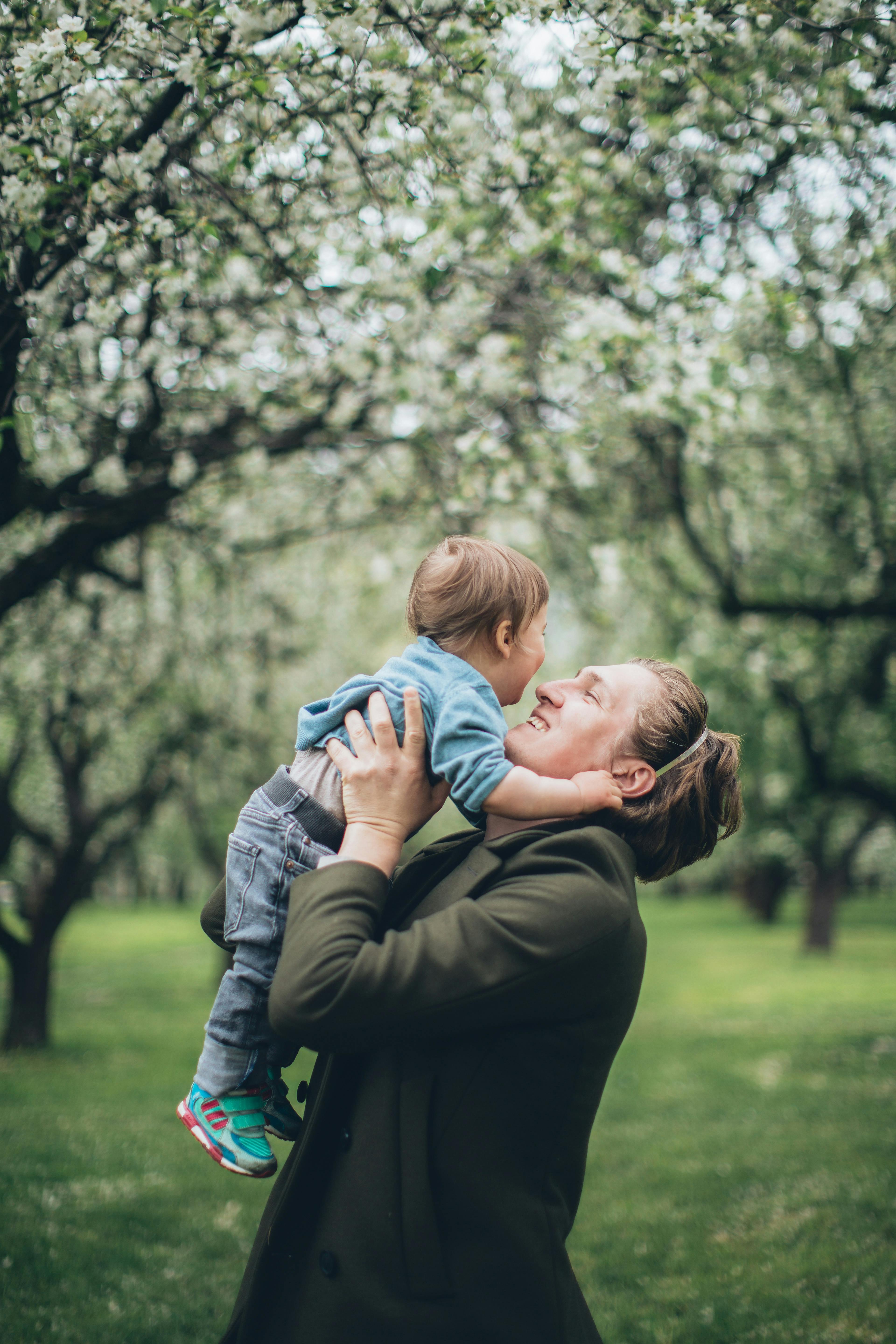 Man Carrying his Baby · Free Stock Photo