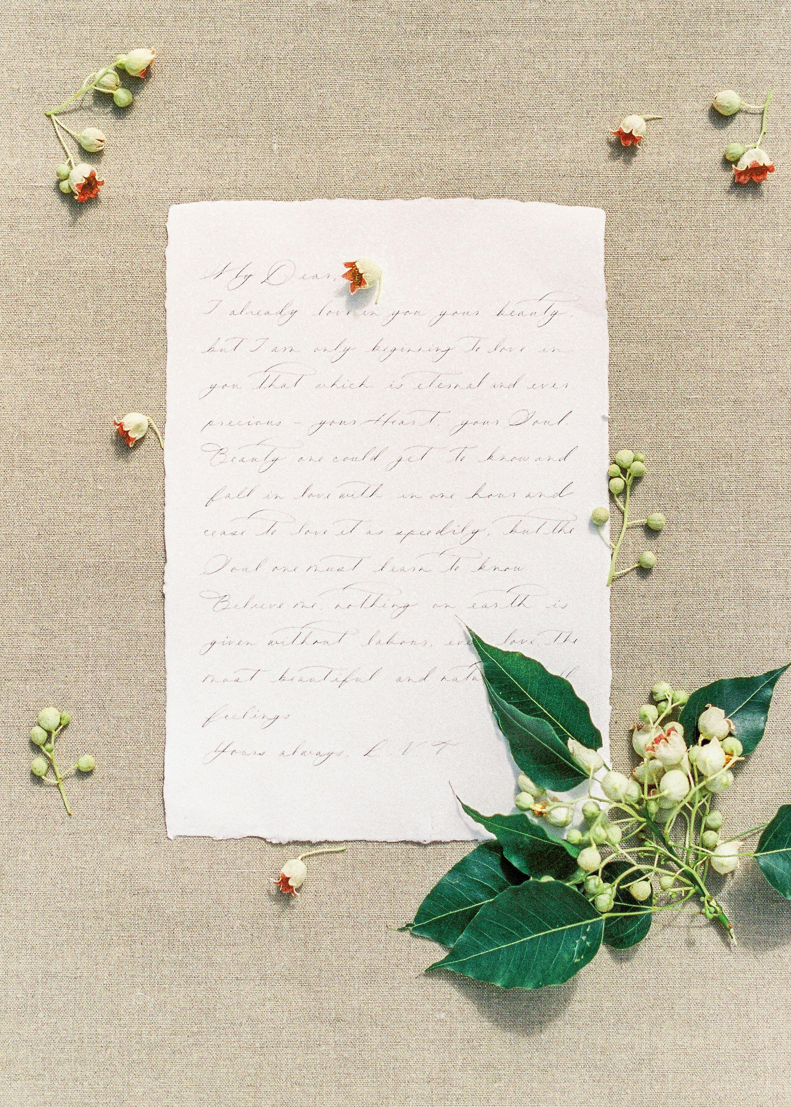 Letter on White Sheet of Paper on Gray Surface · Free Stock Photo