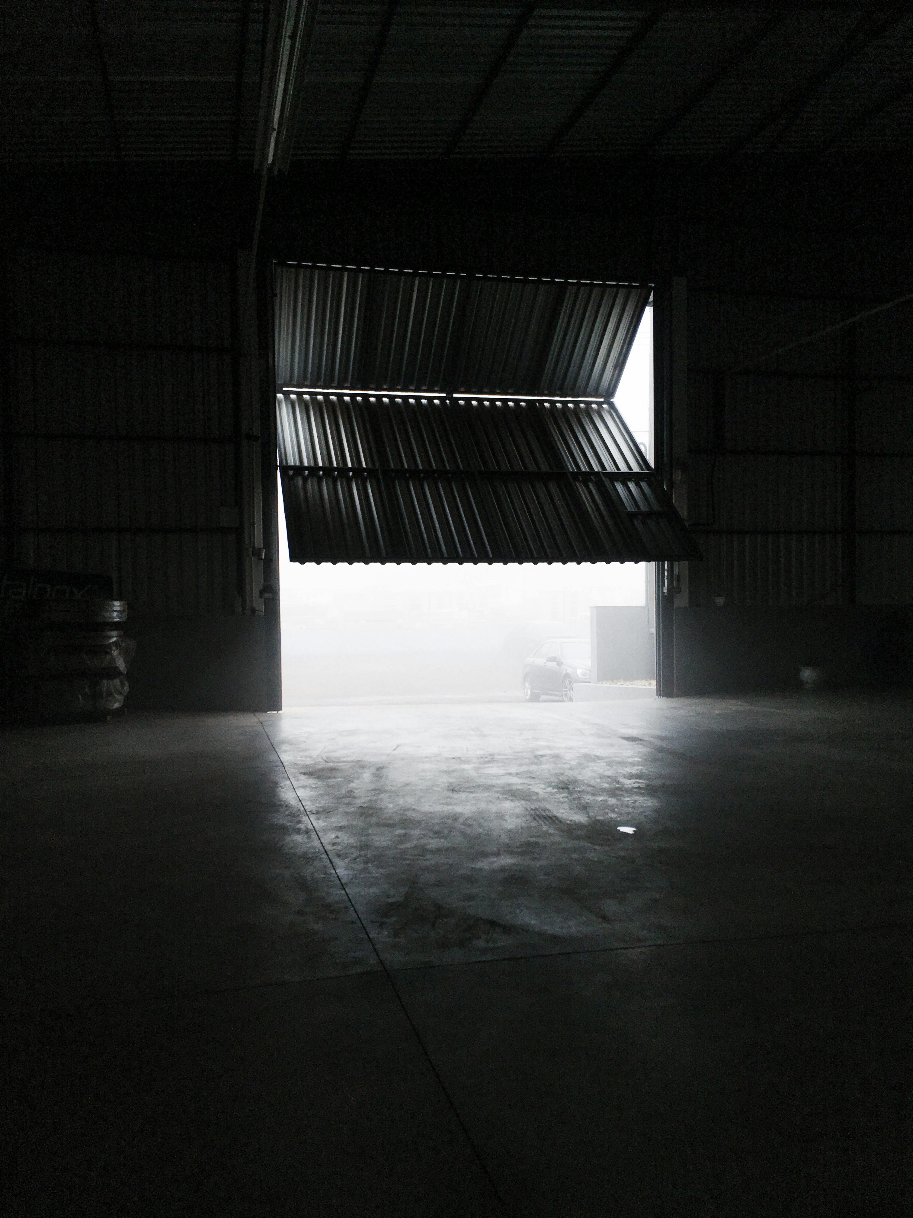 Inside of spacious garage with metal panels · Free Stock Photo