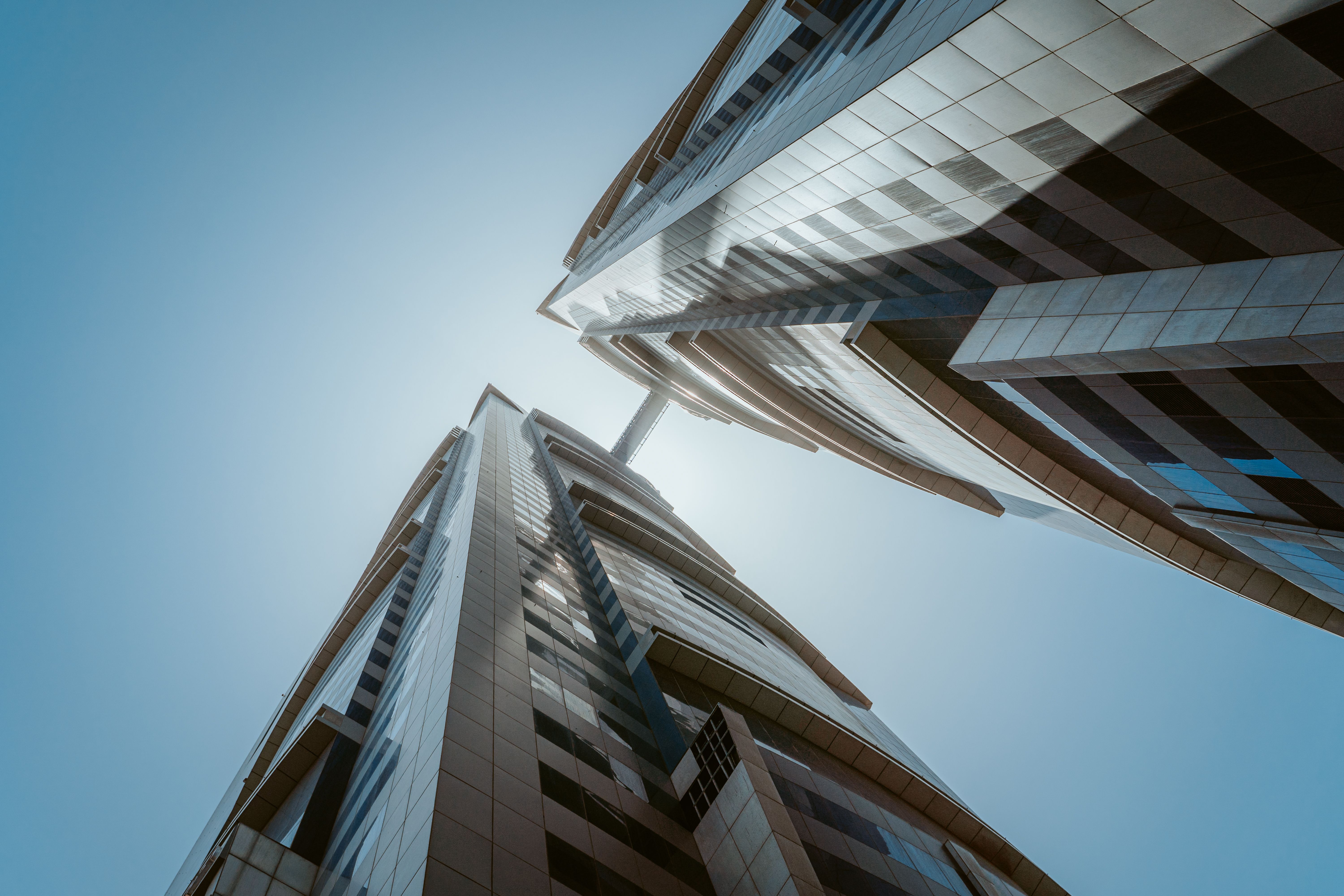 Photo of a Modern Skyscrapers Under the Clear Blue Sky · Free Stock Photo