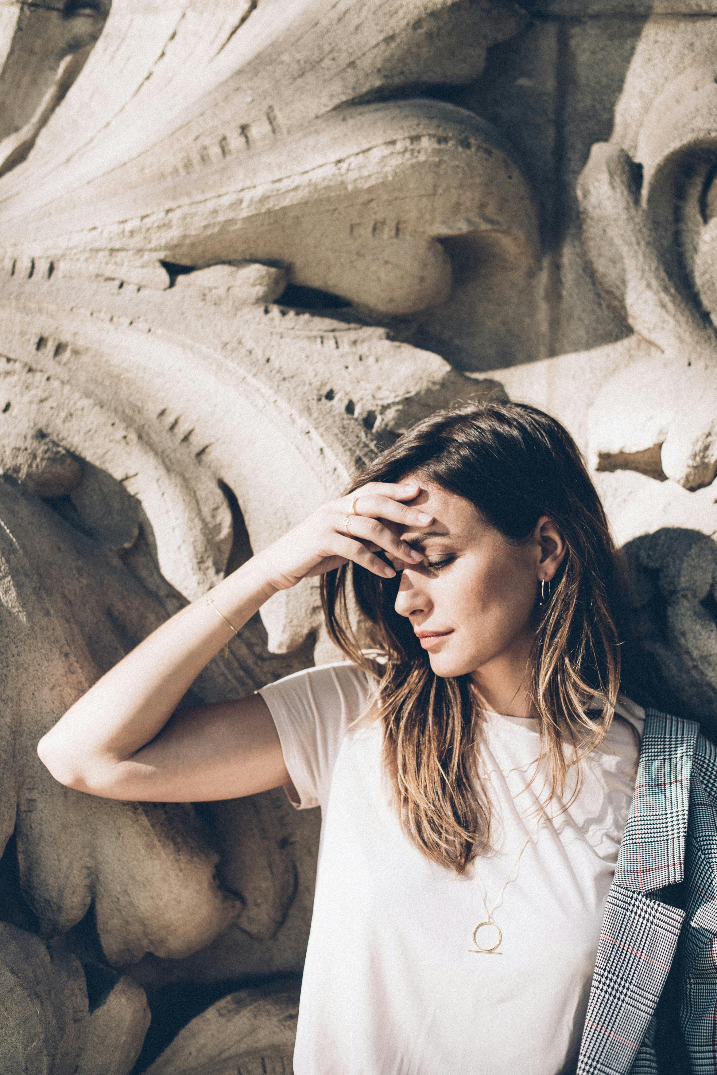 Woman Holding Her Forehead · Free Stock Photo