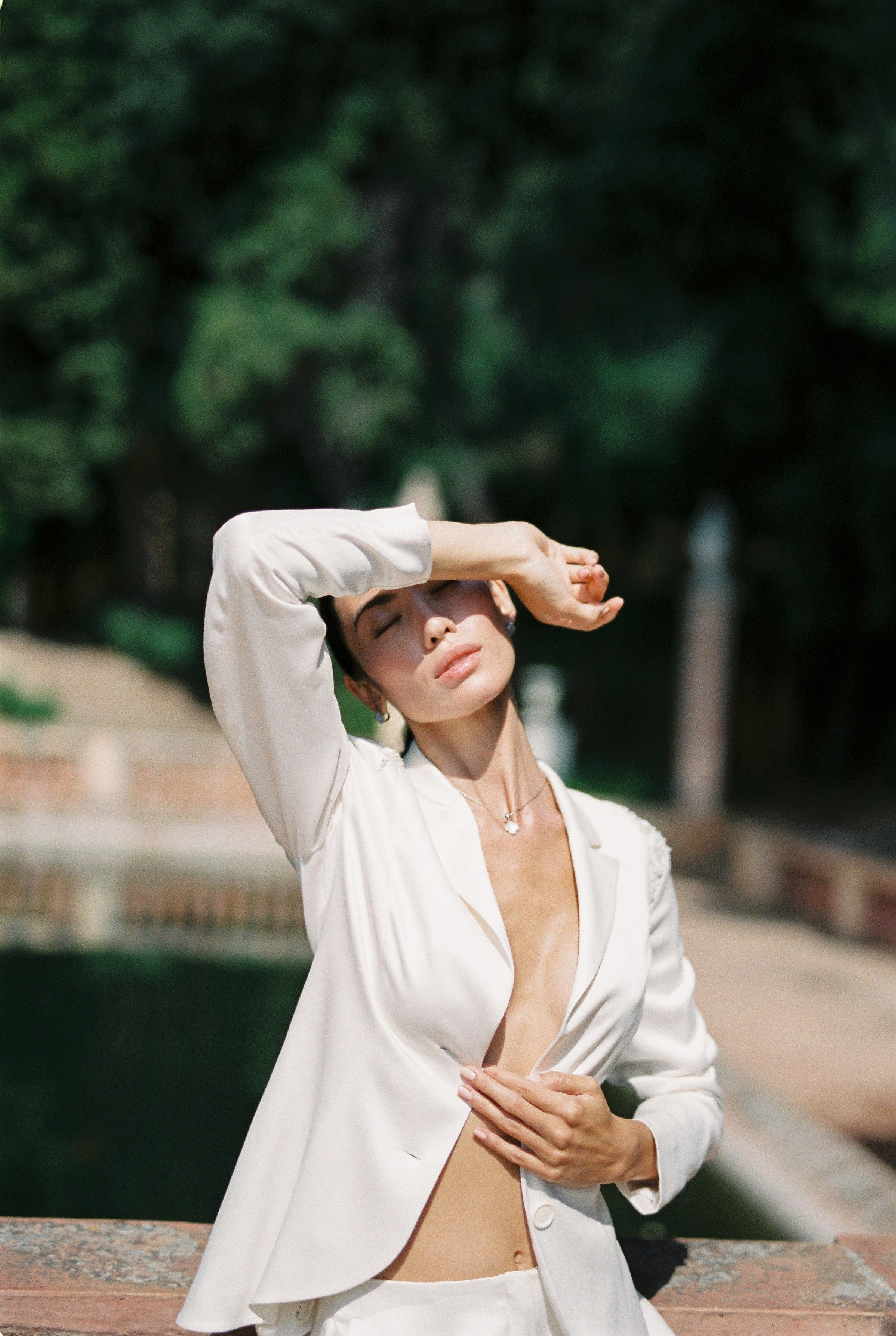 A Female Model Covering Her Face with Her Arm · Free Stock Photo