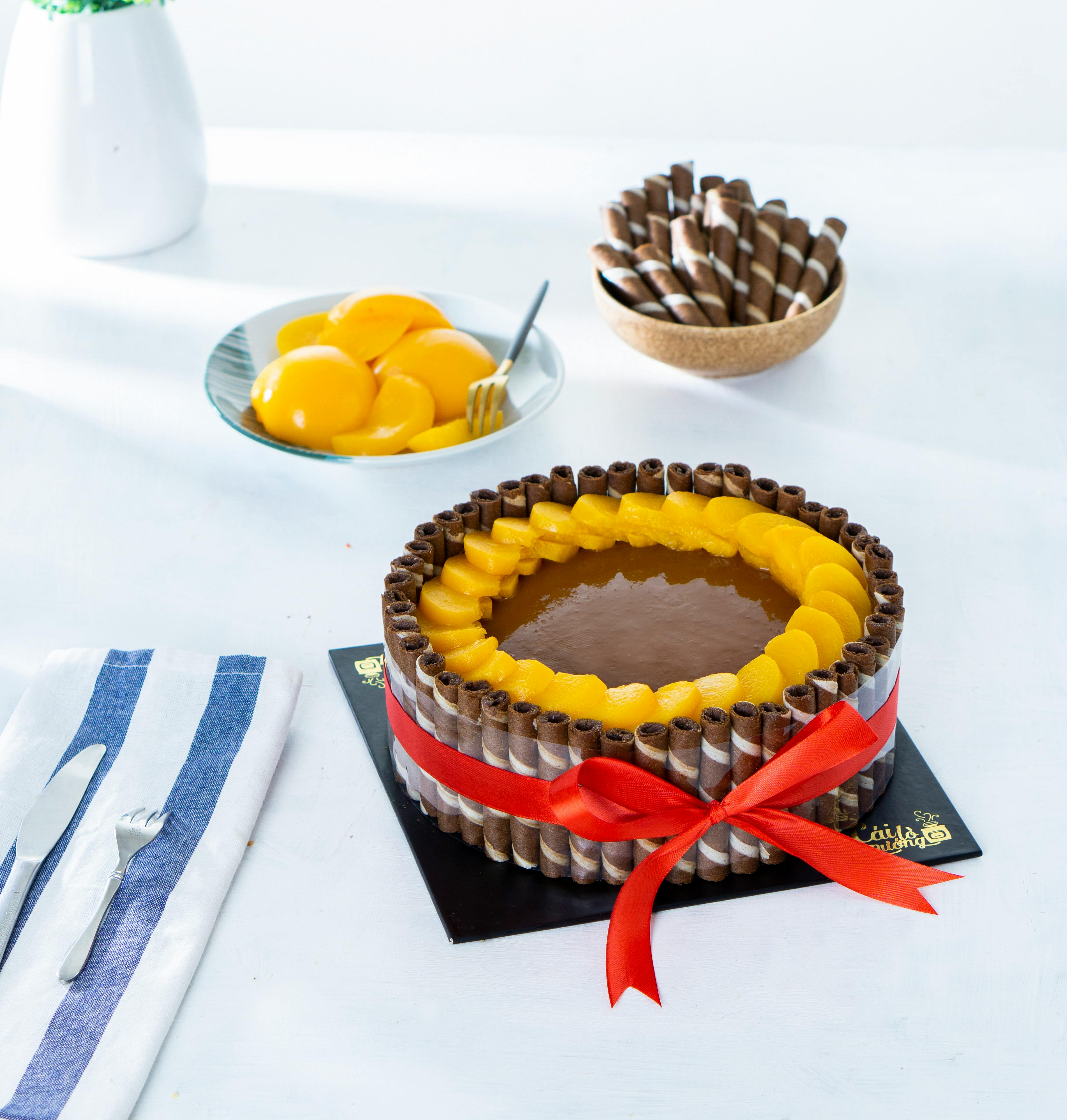 White Round Cake Topped With Yellow Slice Fruit · Free Stock Photo