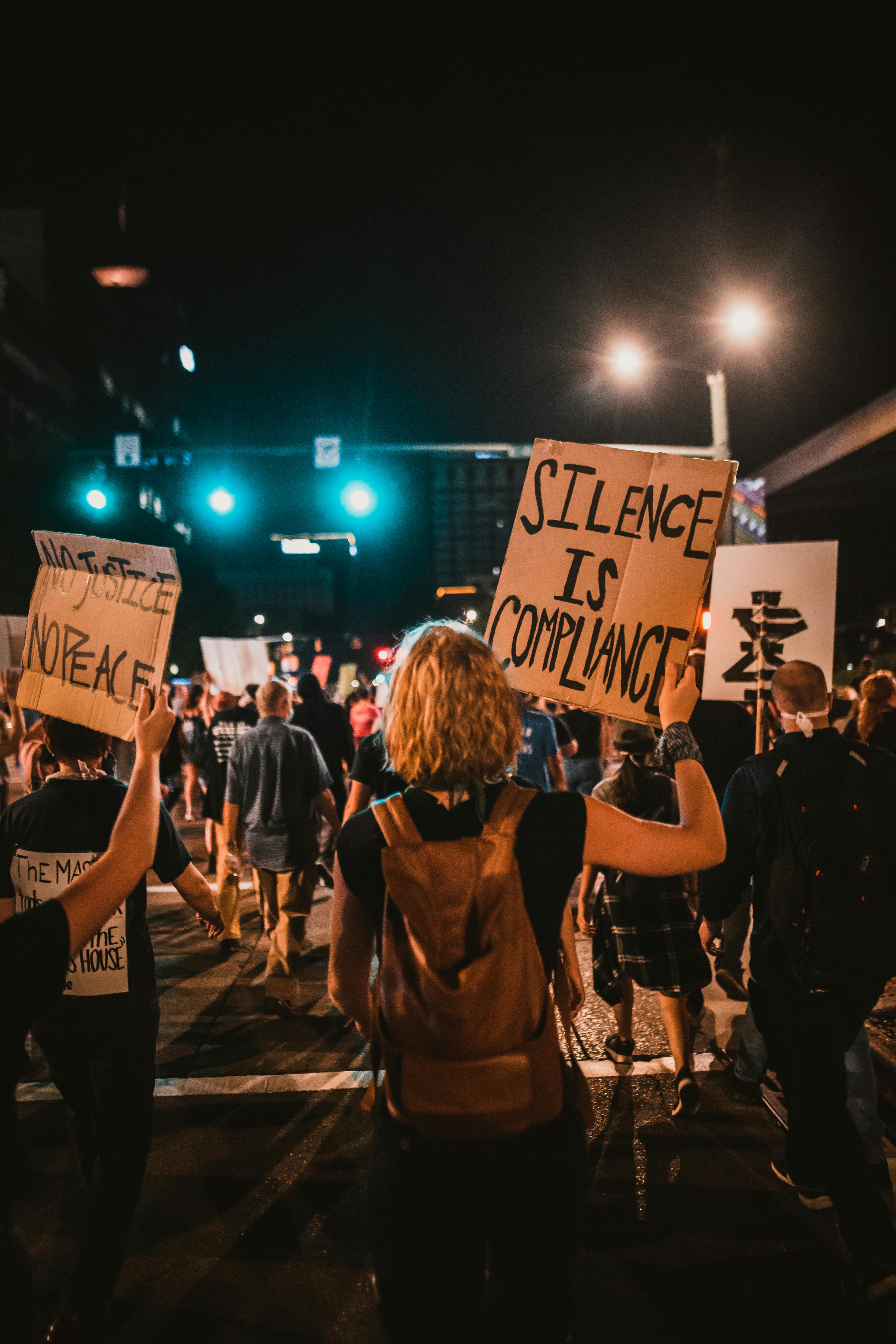 Protesters Holding Signs · Free Stock Photo