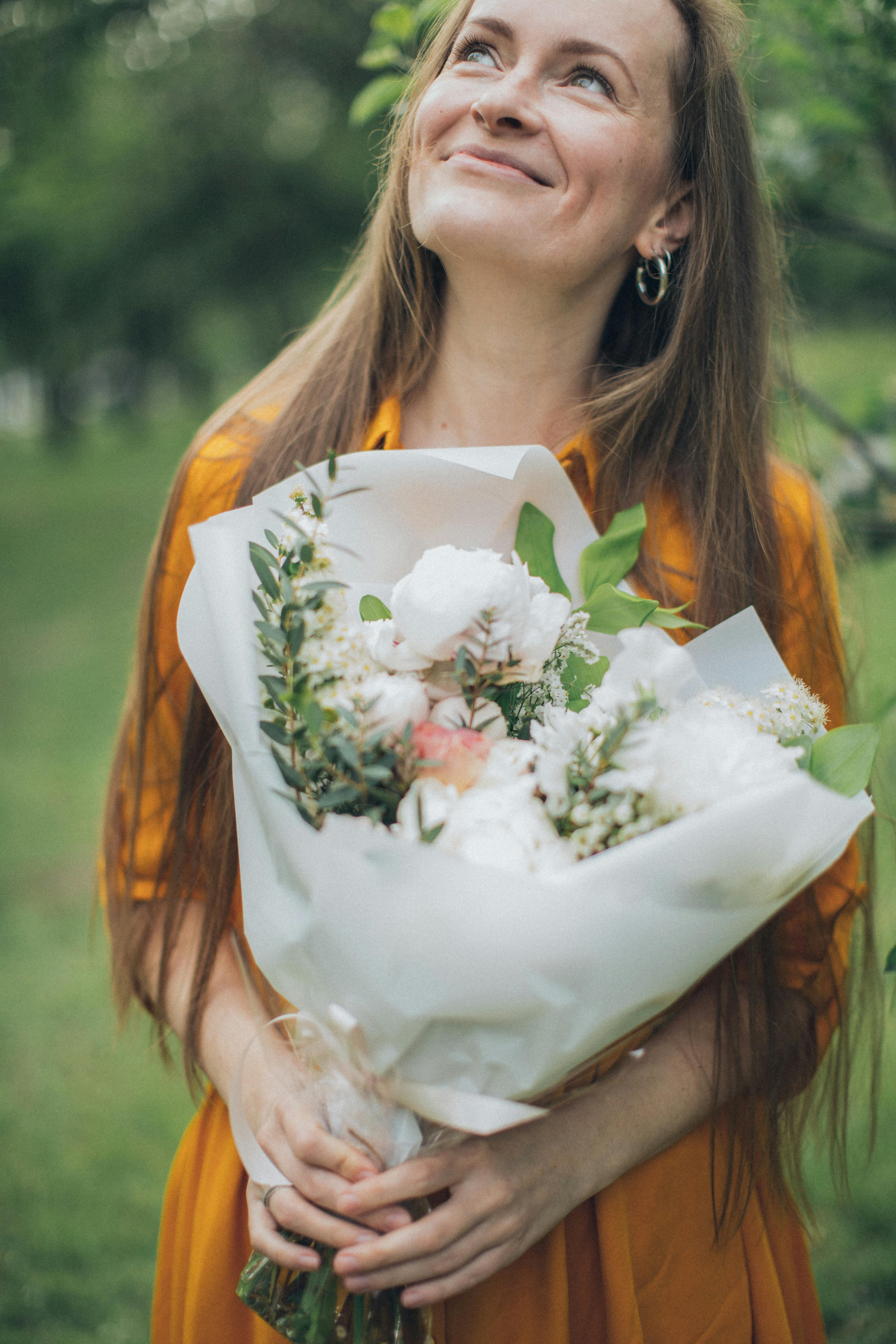 Happy woman with bouquet of flowers · Free Stock Photo