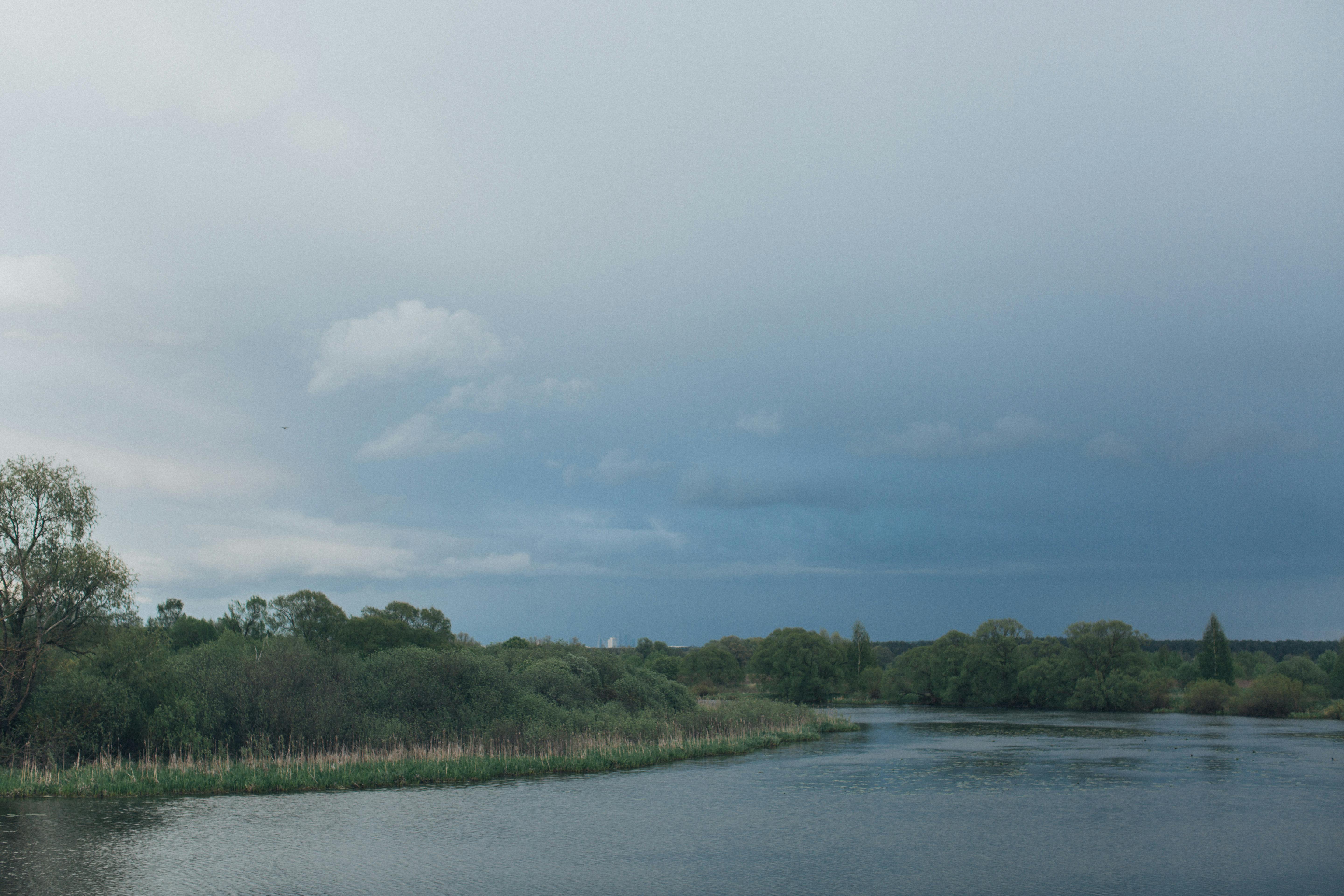 Scenic View of Landscape During Cloudy Sky · Free Stock Photo