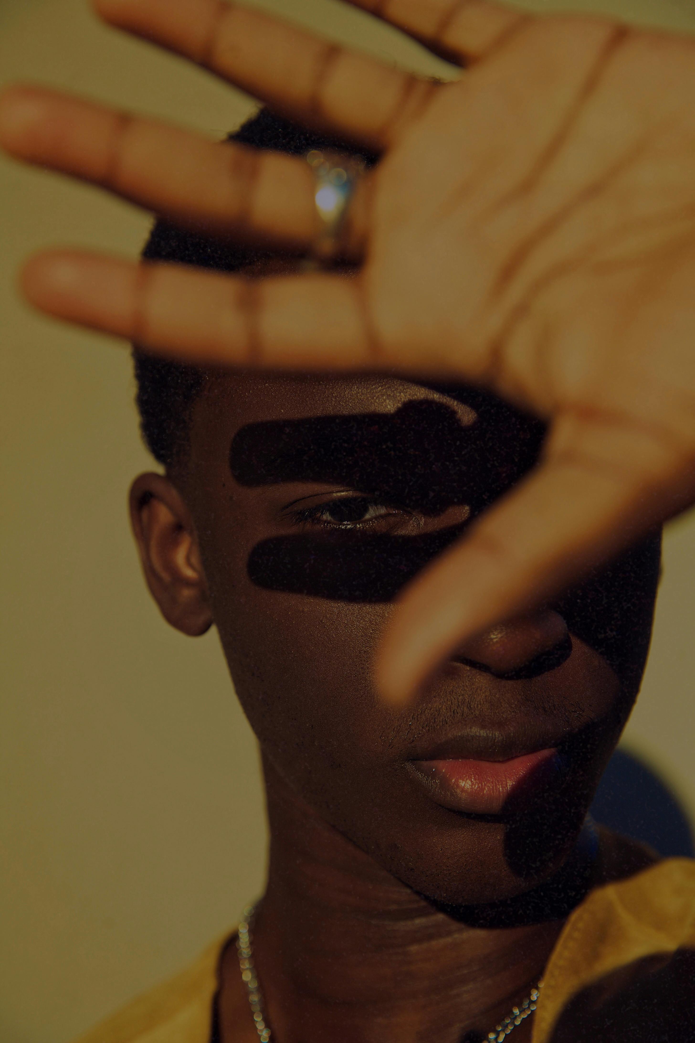 Man Covering His Face with Natural Light · Free Stock Photo