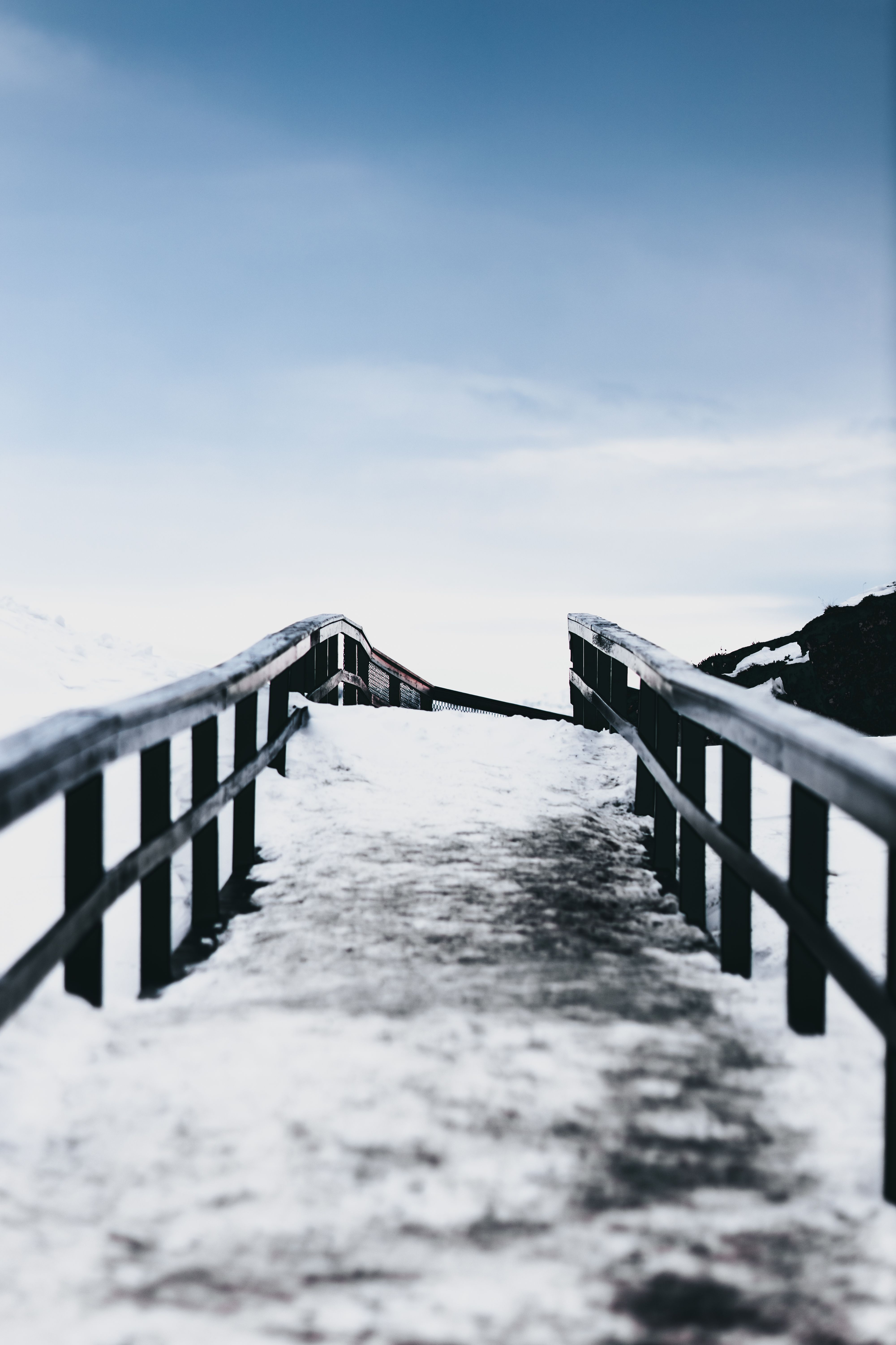 Frozen path in snowy valley in winter · Free Stock Photo