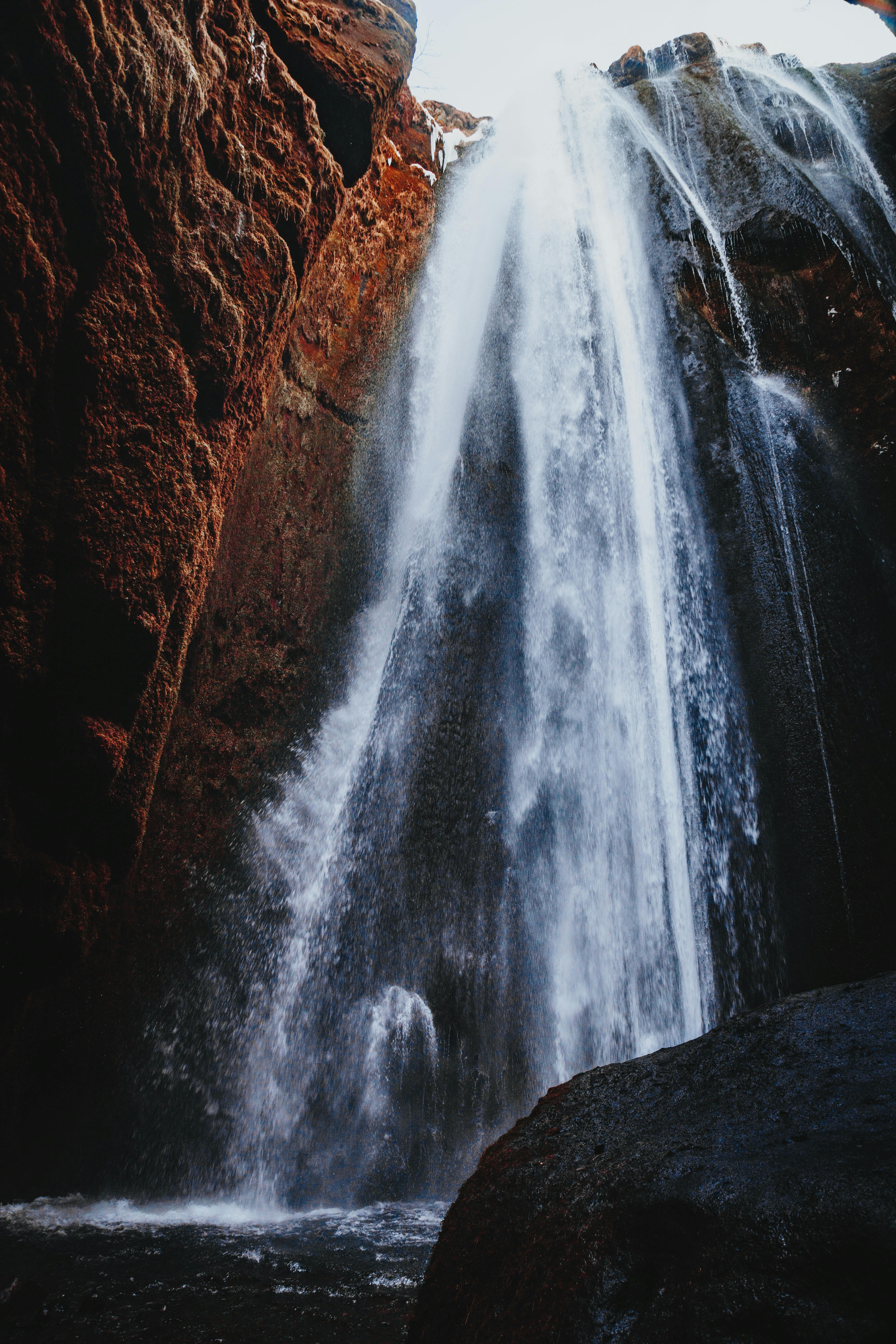 Gorgeous huge waterfall in ravine · Free Stock Photo