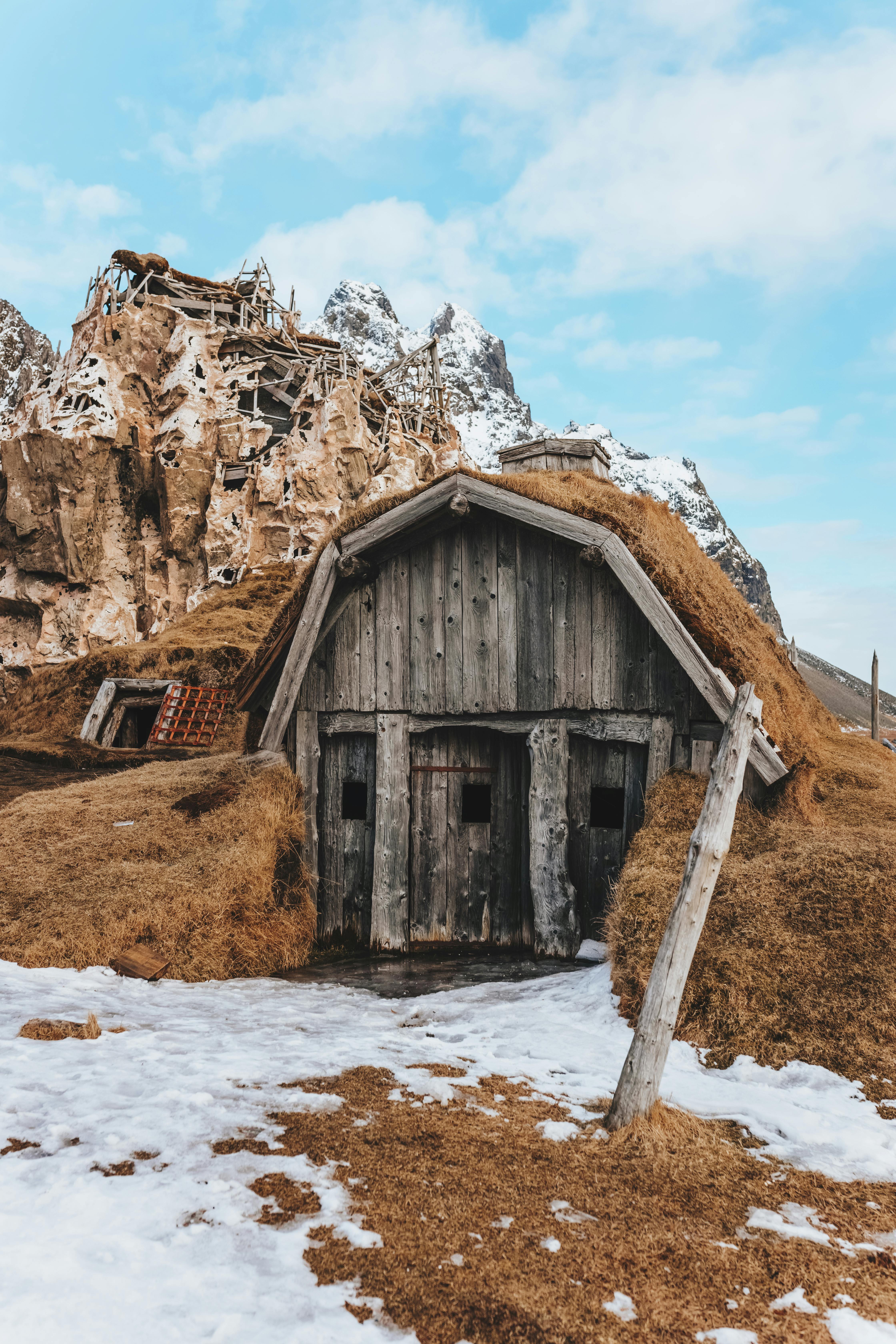 Destroyed wooden cabin in hill · Free Stock Photo