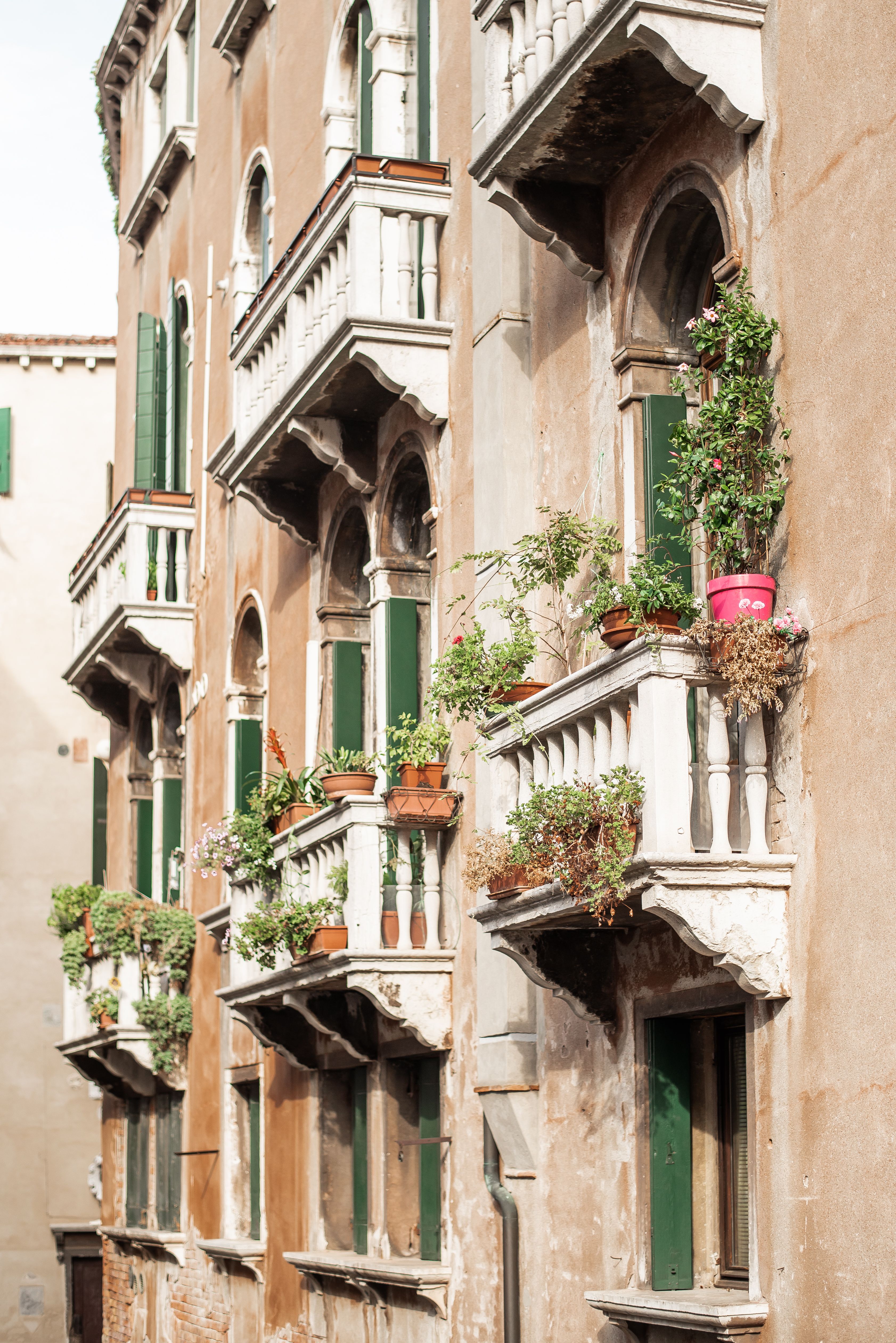 Historical old building with small balconies · Free Stock Photo